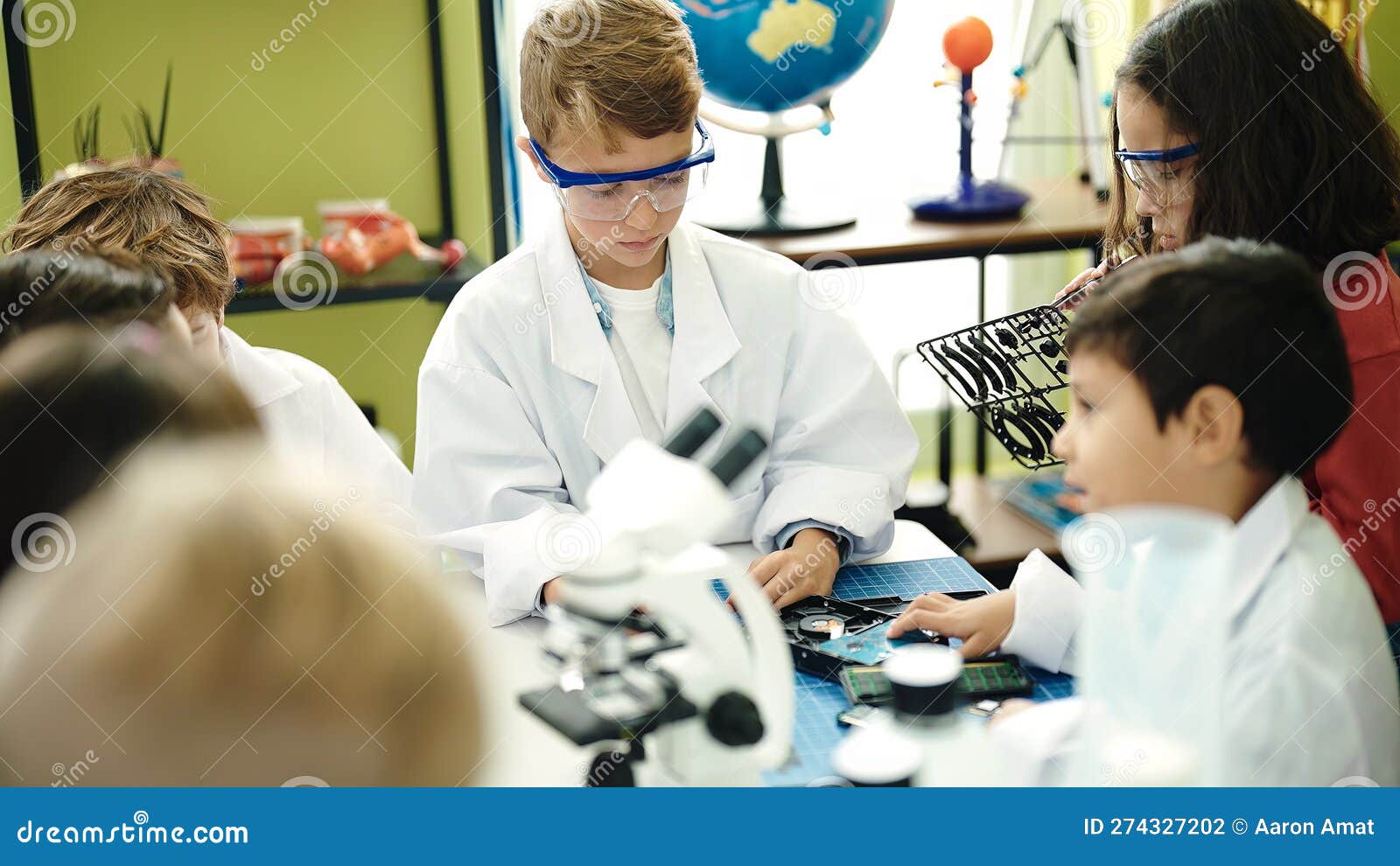 Group of Kids Students Using Microscope Repairing Gadget at Laboratory ...