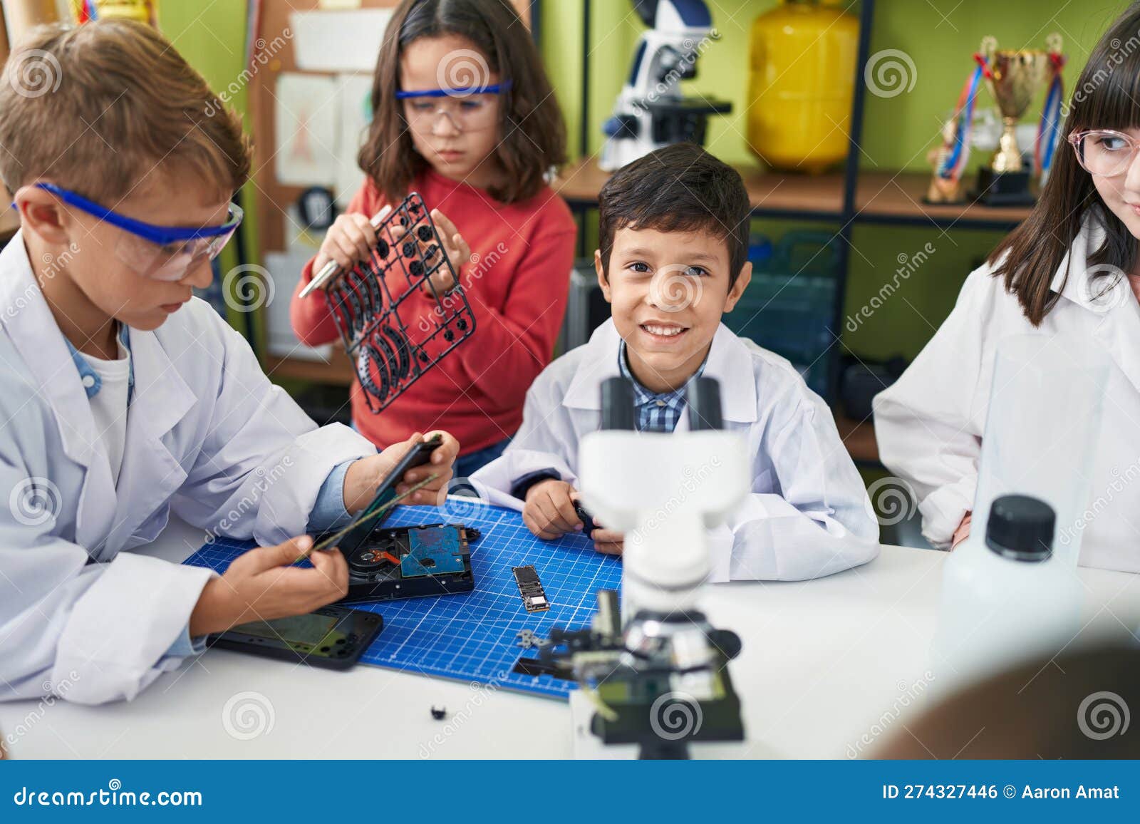 Group of Kids Students Using Microscope Repairing Gadget at Laboratory ...
