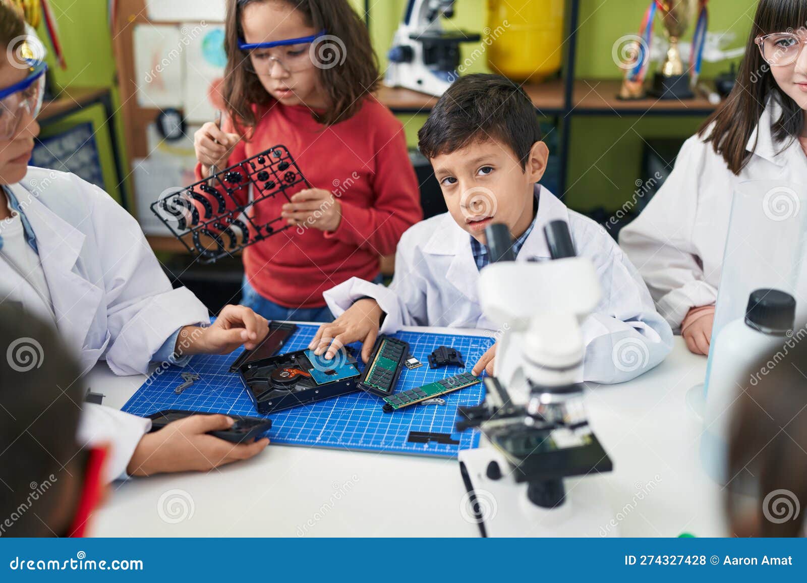 Group of Kids Students Using Microscope Repairing Gadget at Laboratory ...