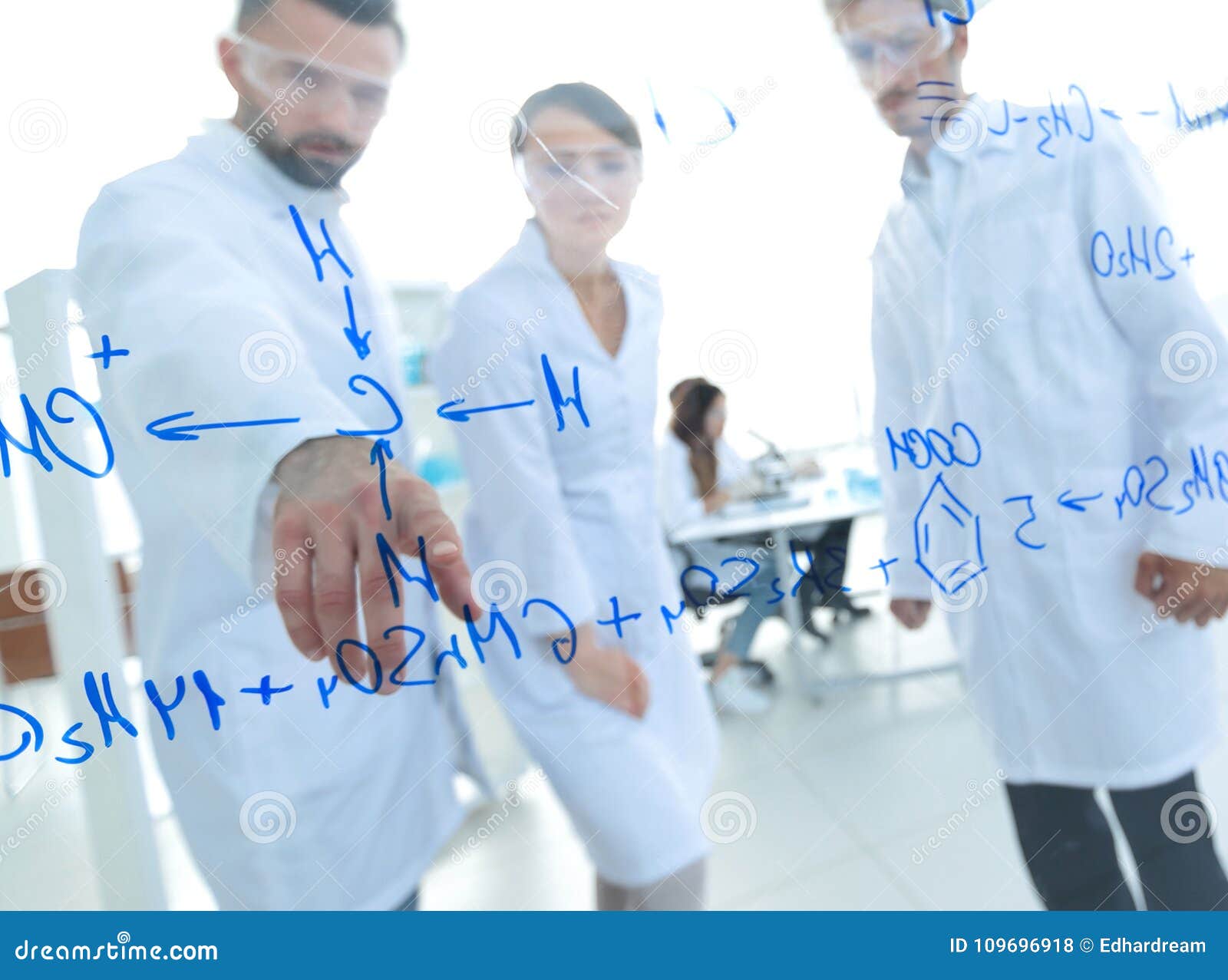 Group of Laboratory Scientists Discussing Their Research in the ...