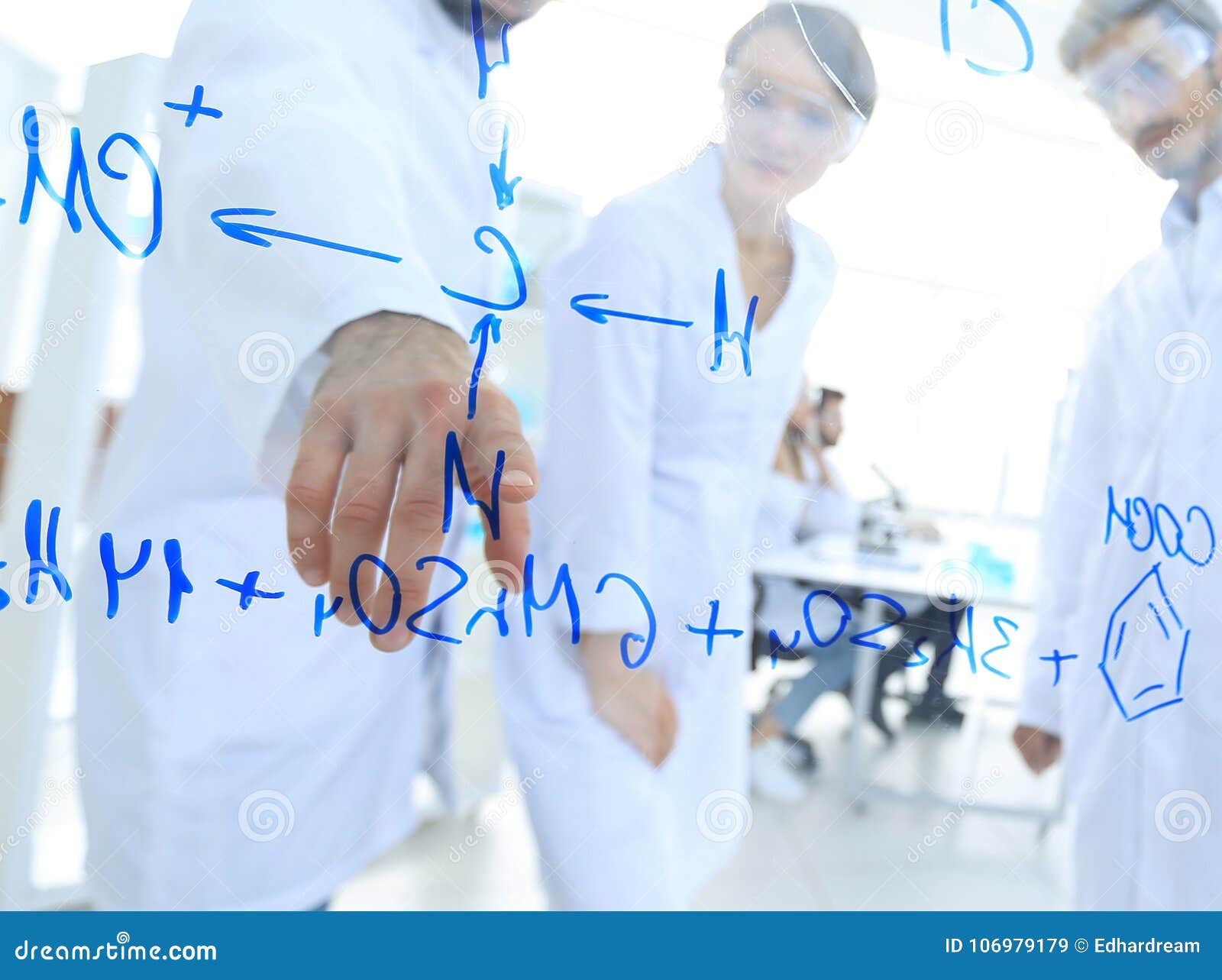 Group of Laboratory Scientists Discussing Their Research in the ...