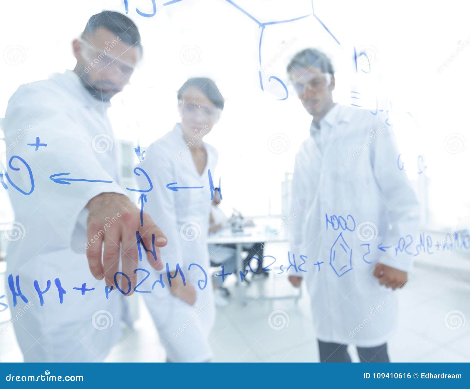 Group of Laboratory Scientists Discussing Their Research in the ...