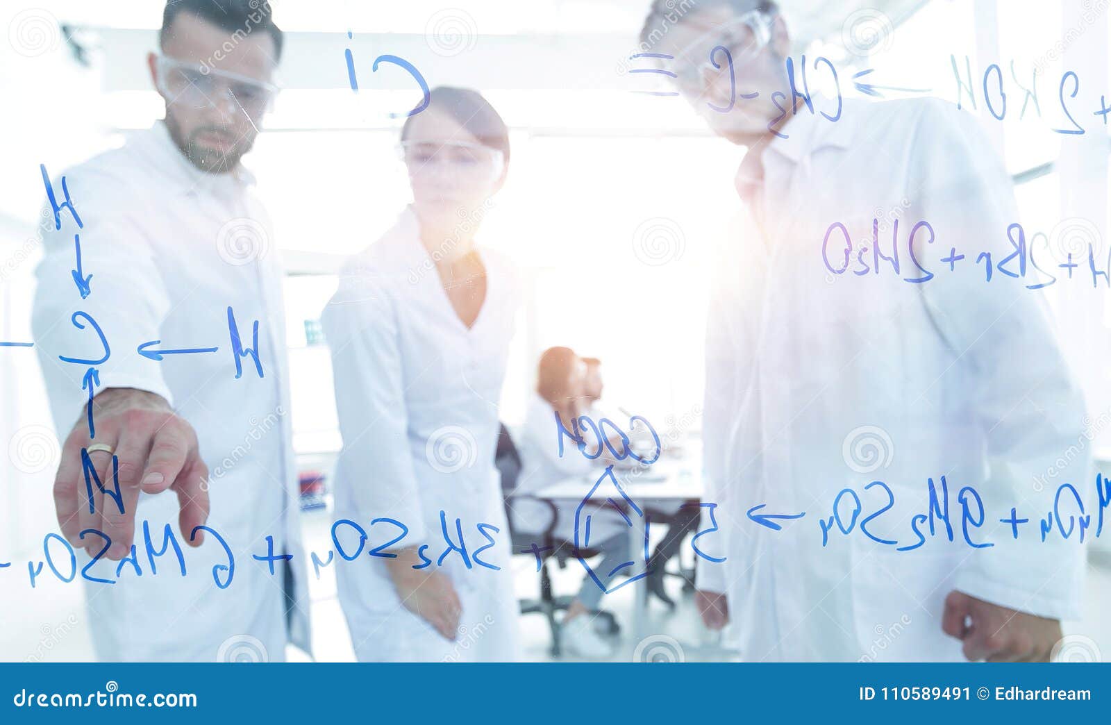 Group of Laboratory Scientists Discussing Their Research in the ...