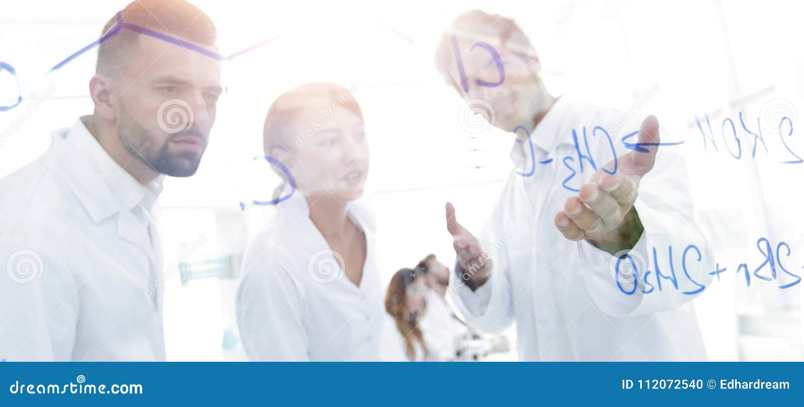 Group of Laboratory Scientists Discussing Their Research in the Stock ...