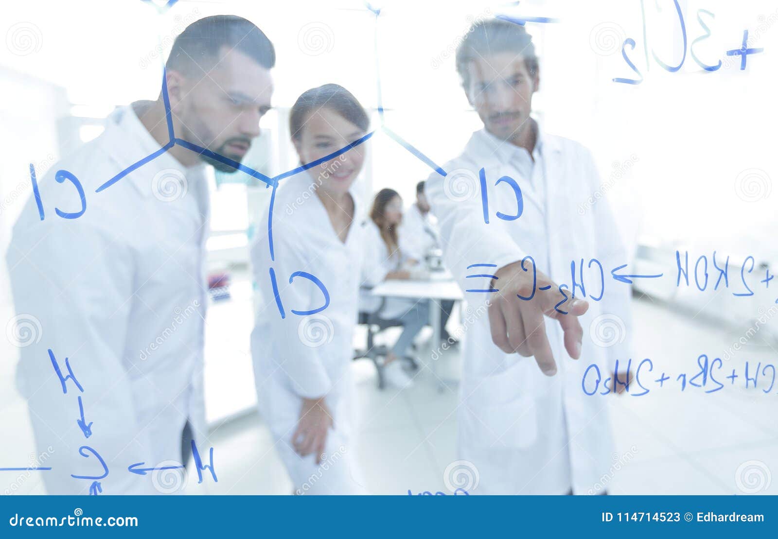 Group of Laboratory Scientists Discussing Their Research in the ...