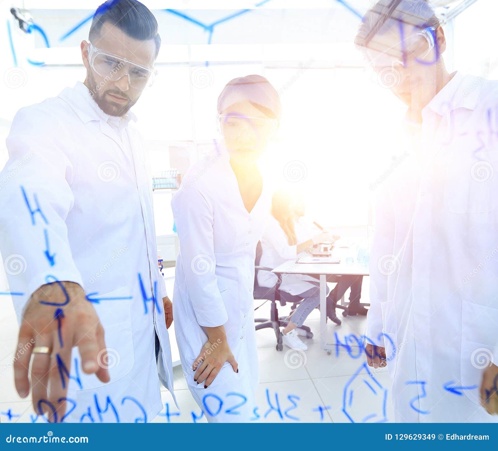 Group of Laboratory Scientists Discussing Their Research in the Stock ...