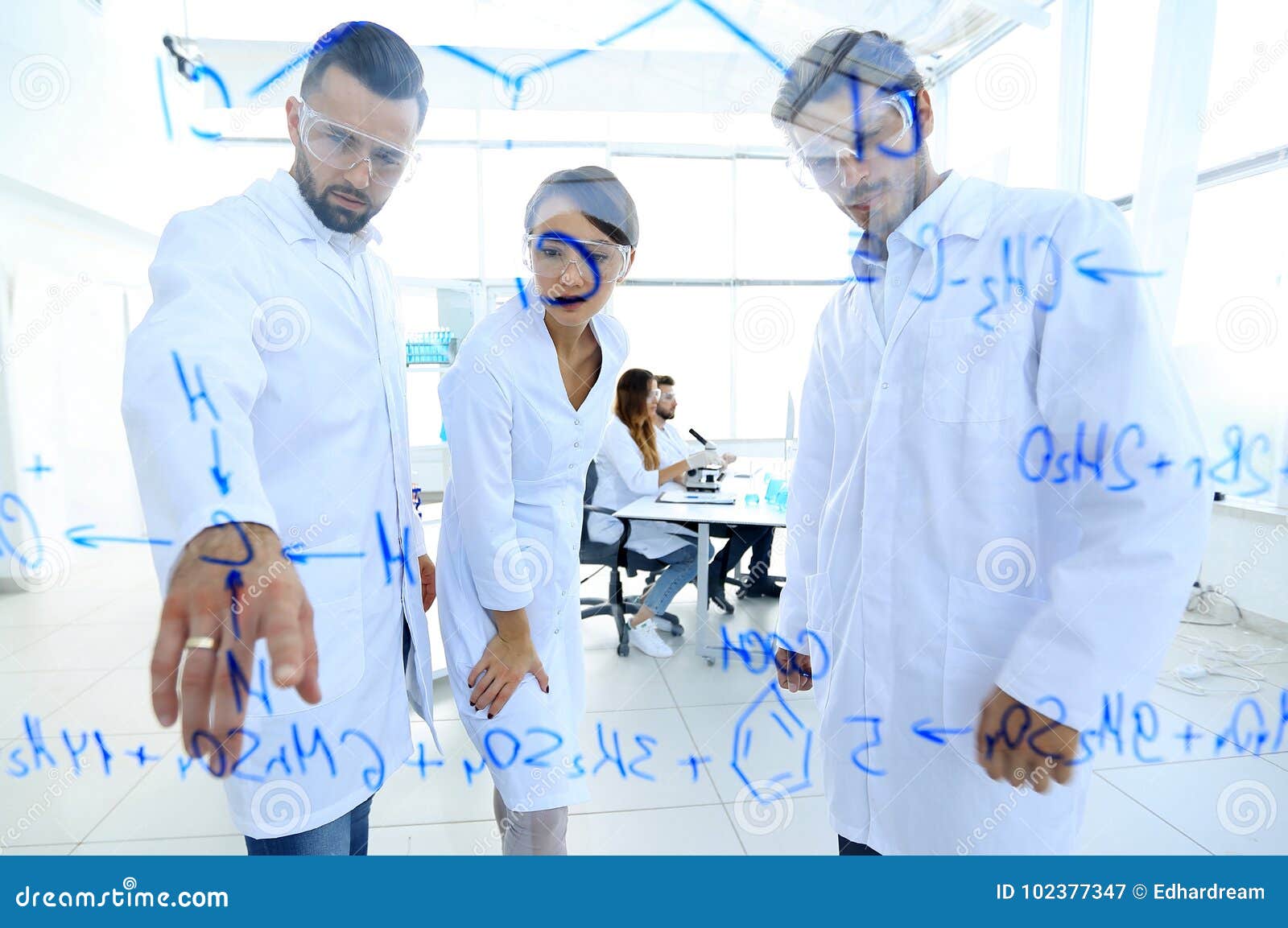 Group of Laboratory Scientists Discussing Their Research in the ...