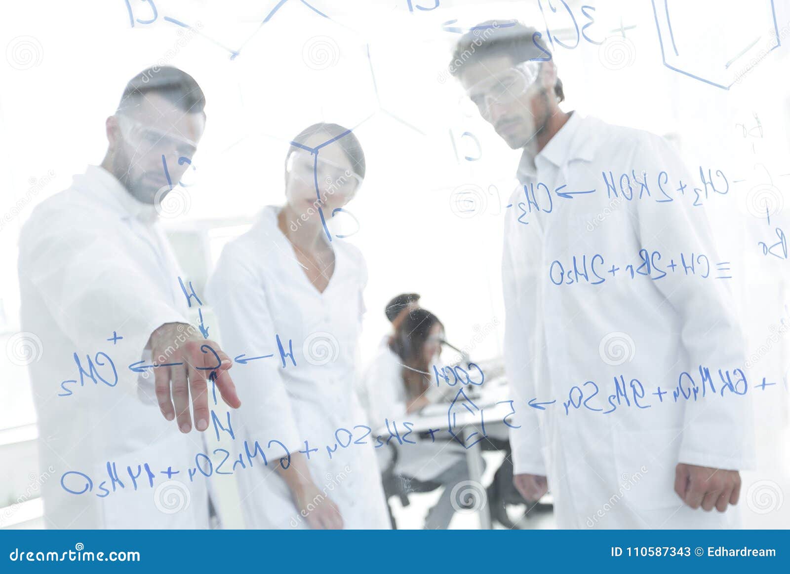 Group of Laboratory Scientists Discussing Their Research in the ...