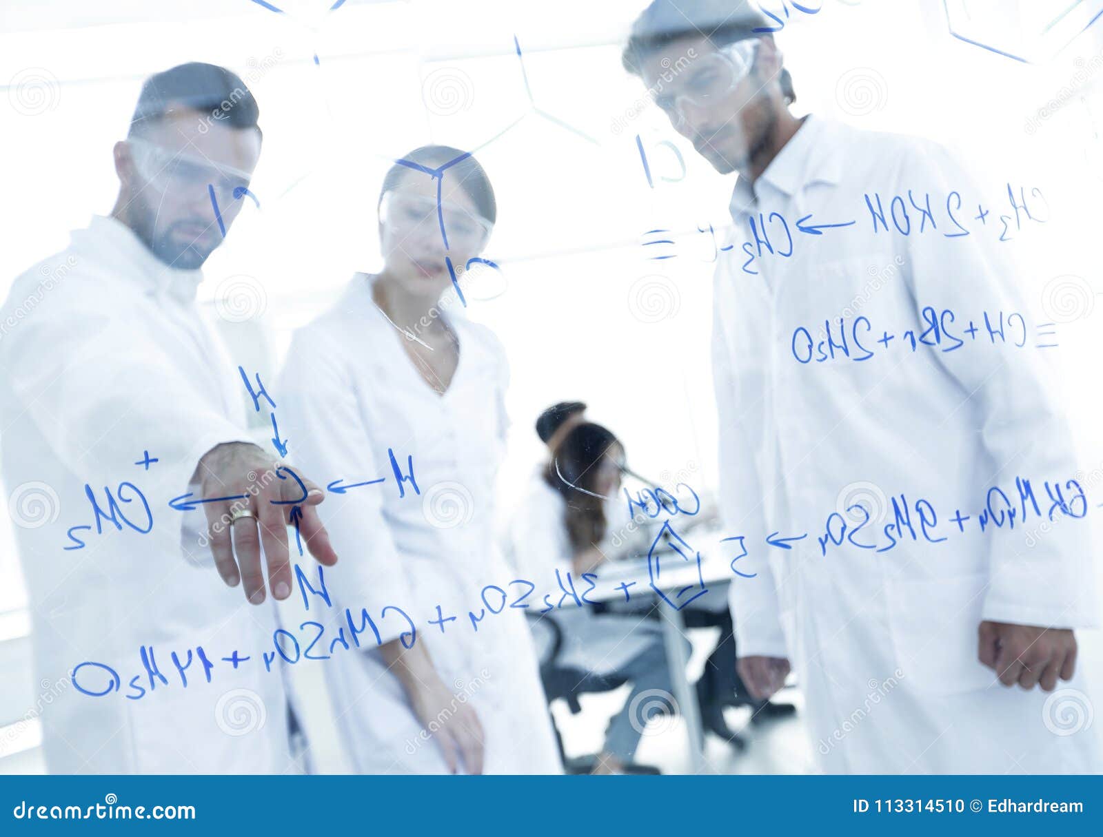 Group of Laboratory Scientists Discussing Their Research in the ...