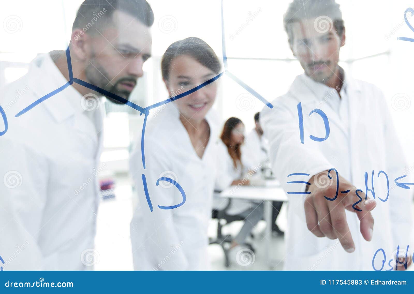 Group of Laboratory Scientists Discussing Their Research in the ...