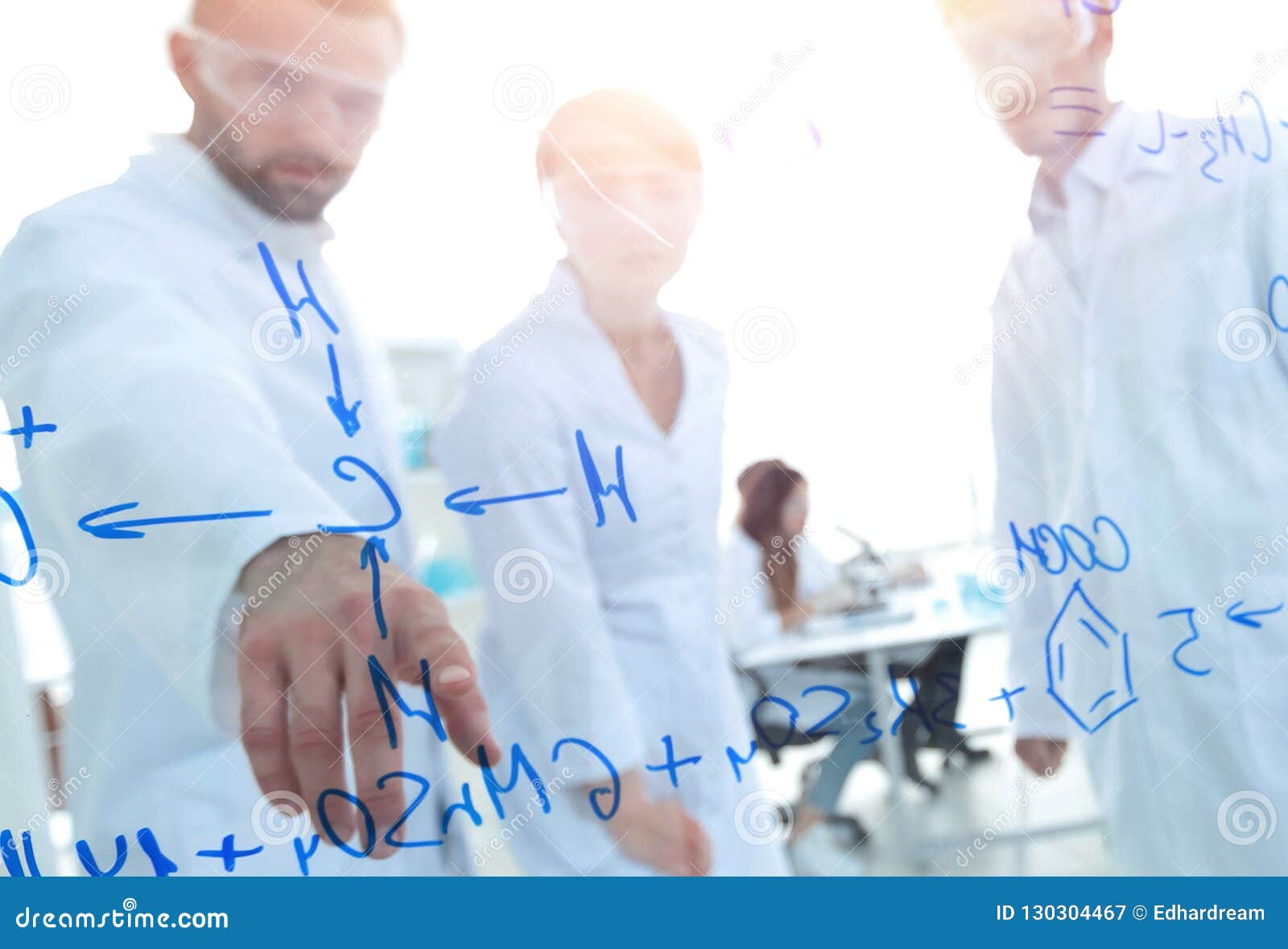 Group of Laboratory Scientists Discussing Their Research in the ...