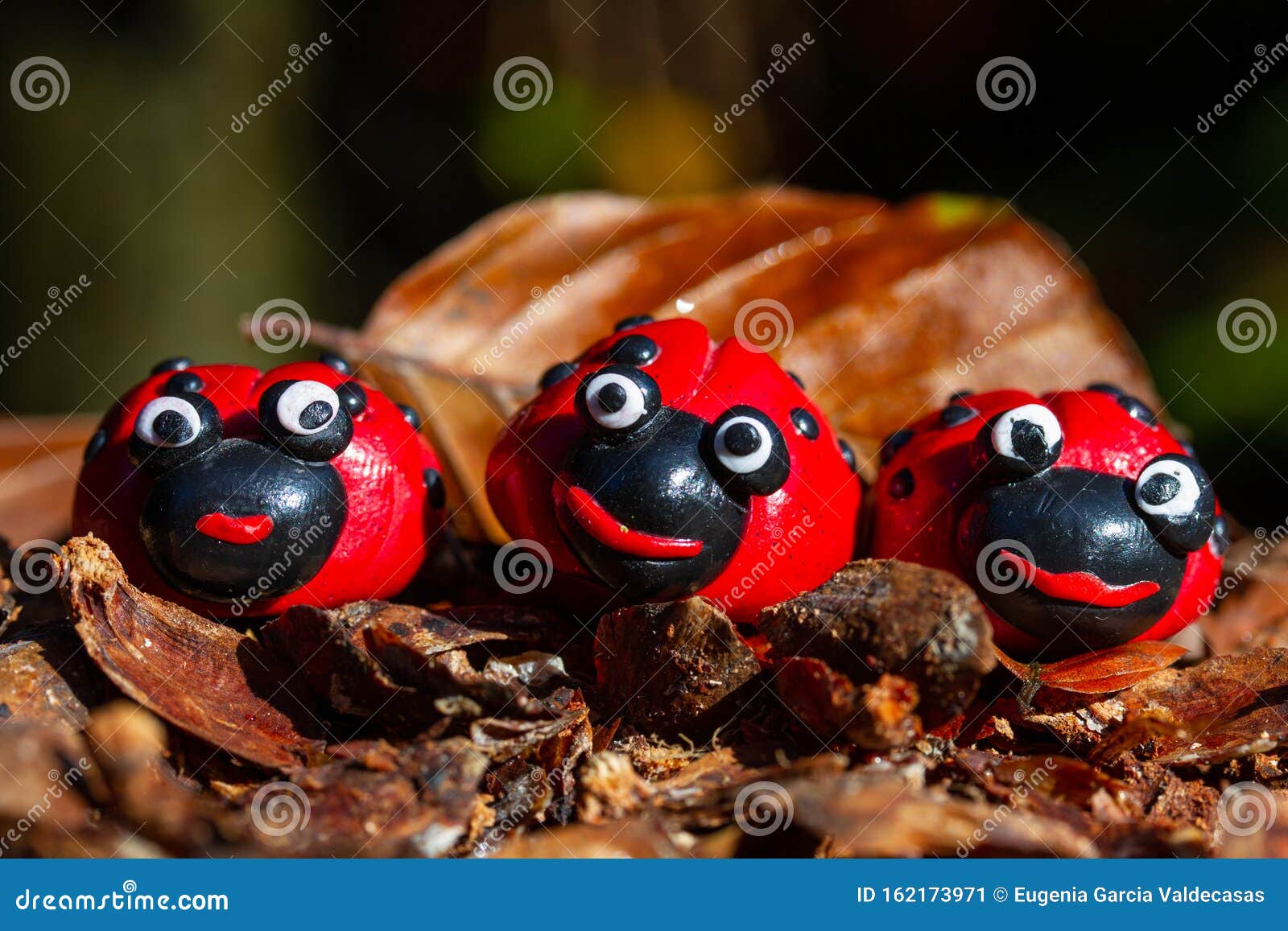 Group of Ladybug Figures with Autumn Background Stock Image - Image of ...
