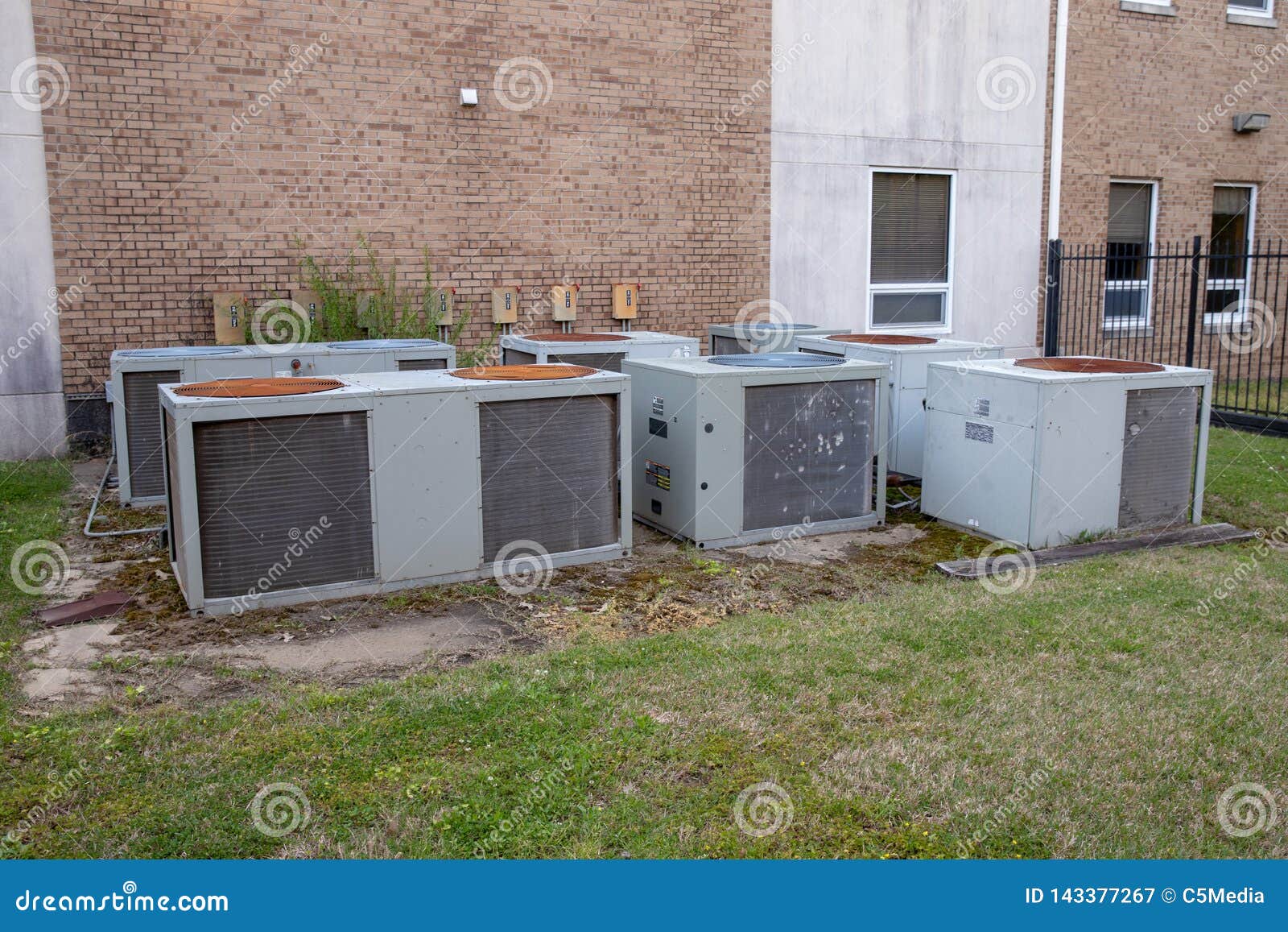 Group of Large Air Conditioner Compressors Outside Commerical Building ...