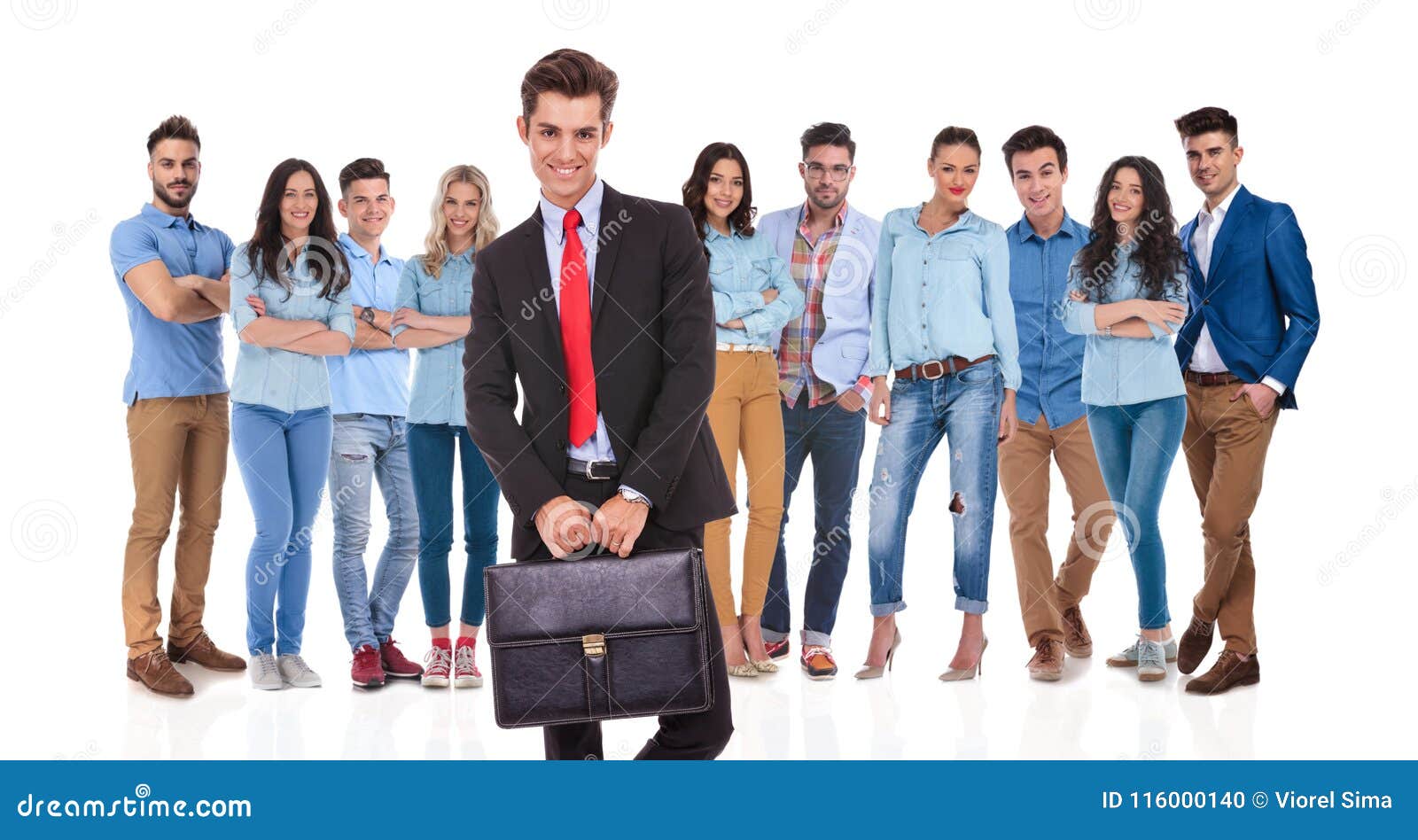 Group Leader Standing While Holding Suitcase With Both Hands Stock ...