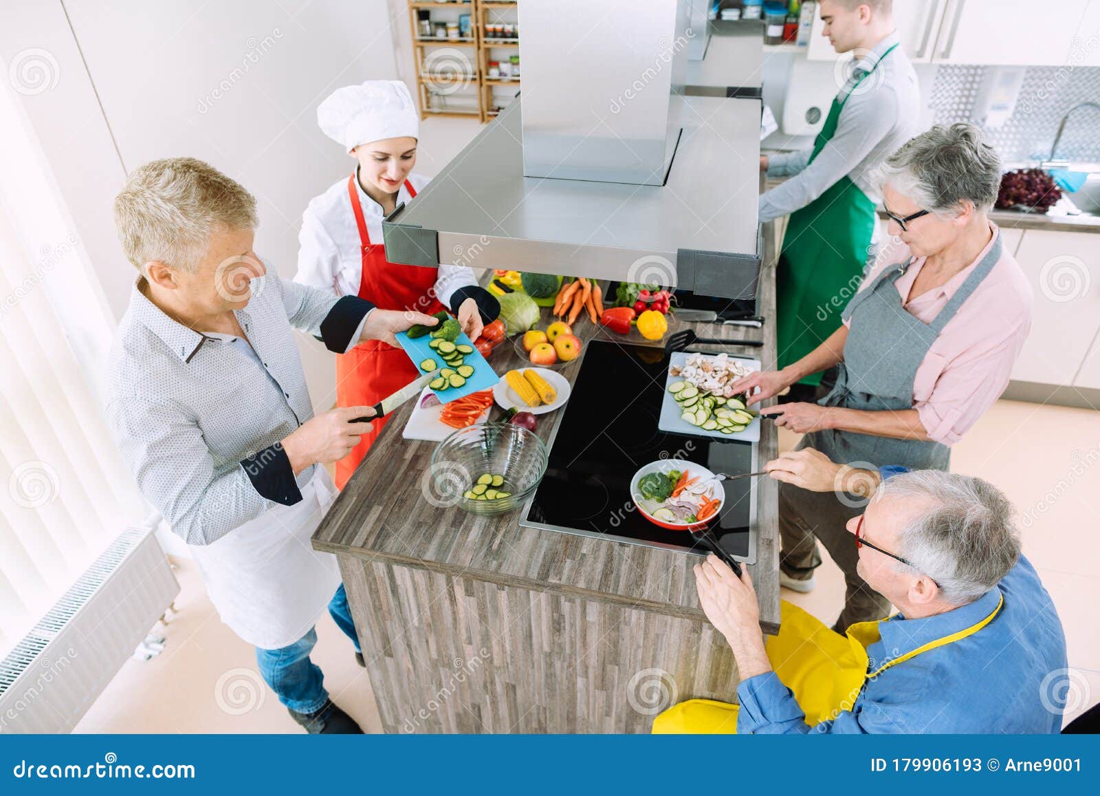 Group Learning Cooking in Training Kitchen with Nutritionist Stock ...