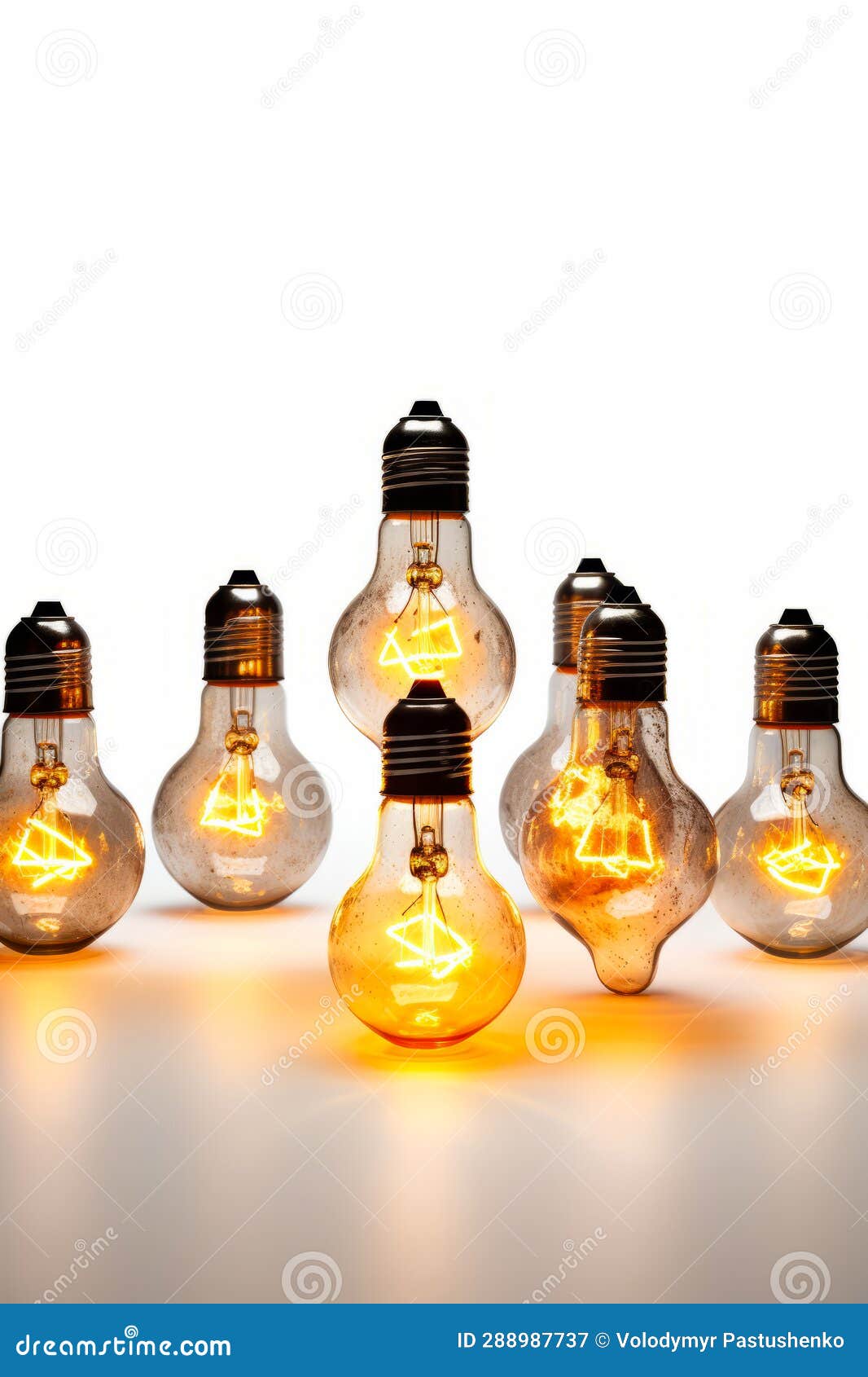 Group of Light Bulbs with Light Inside of Them on White Surface ...