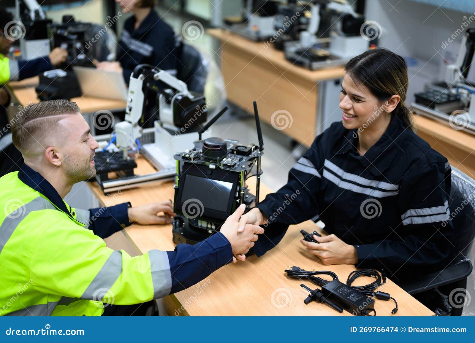 Group of Maintenance Engineers Checking and Repairing Automatic Robotic ...