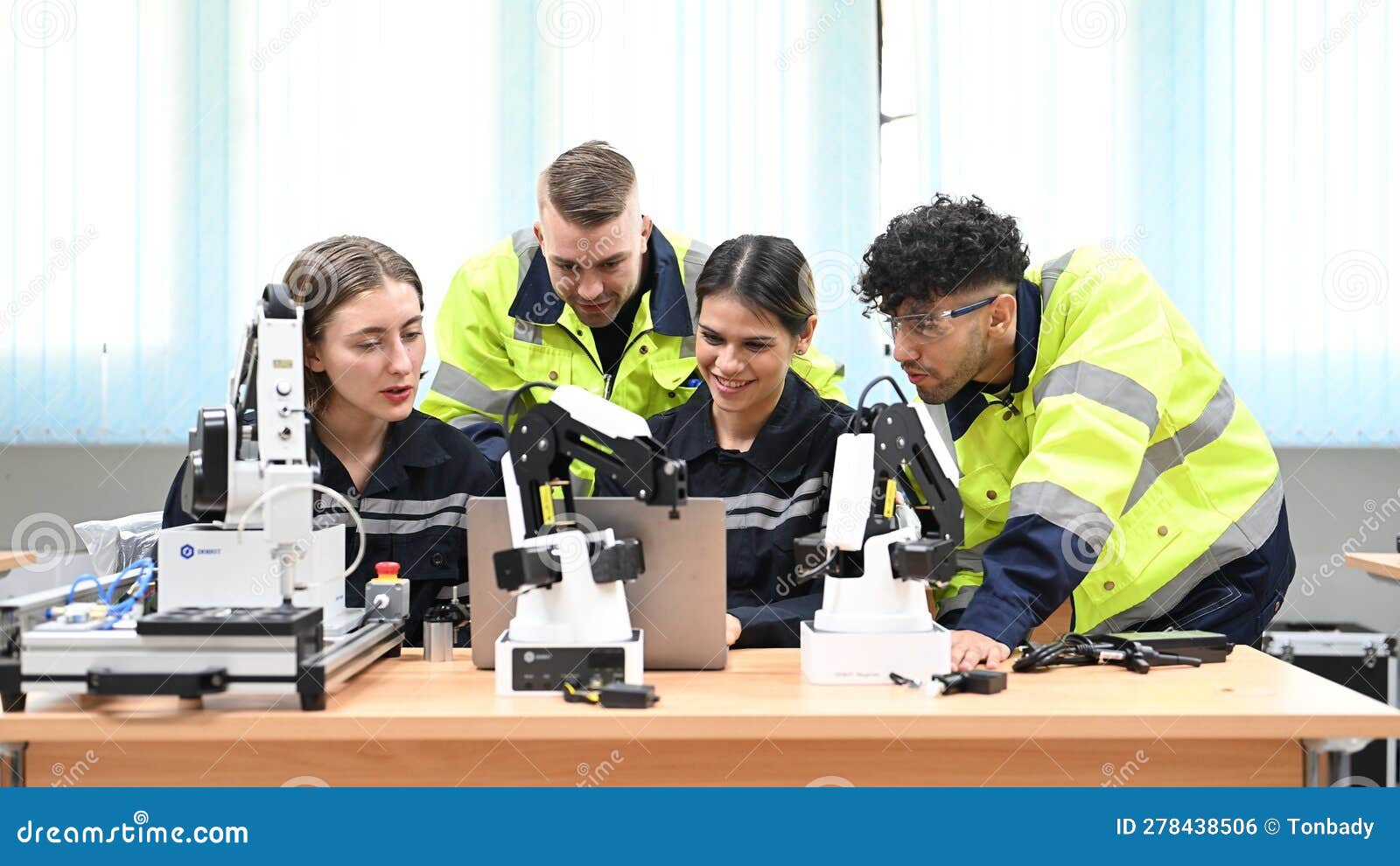 Group of Maintenance Engineers Working with Robot Maintenance Stock ...