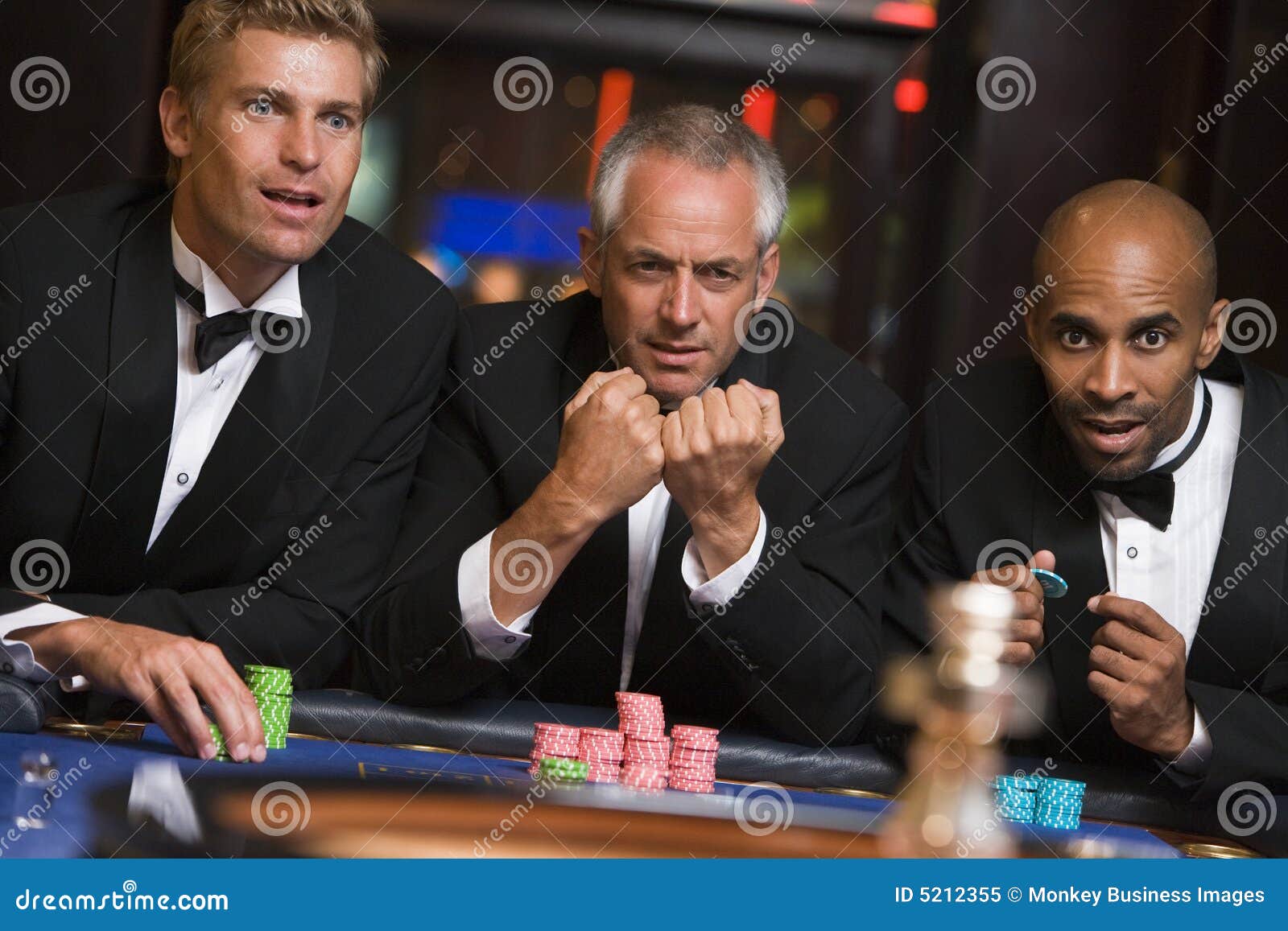 Group of Male Friends Gambling at Roulette Table Stock Image - Image of ...