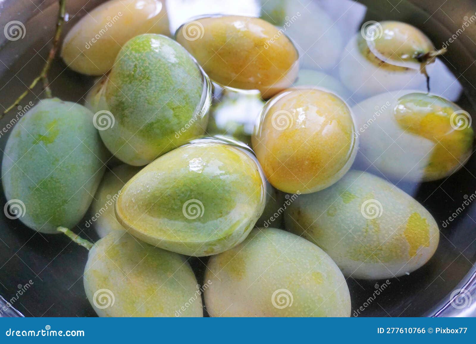 Group of Mango Washing in Basin Close Up Group of Mango Washing in ...
