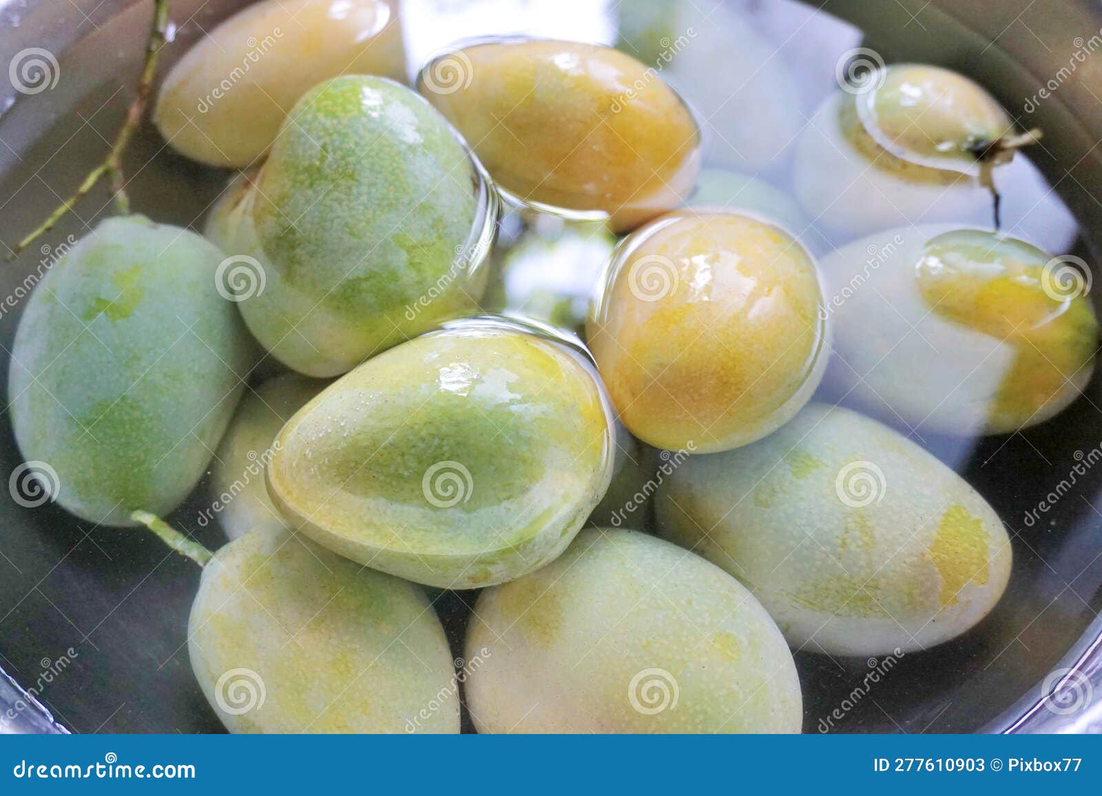 Group of Mango Washing in Basin Close Up Group of Mango Washing in ...