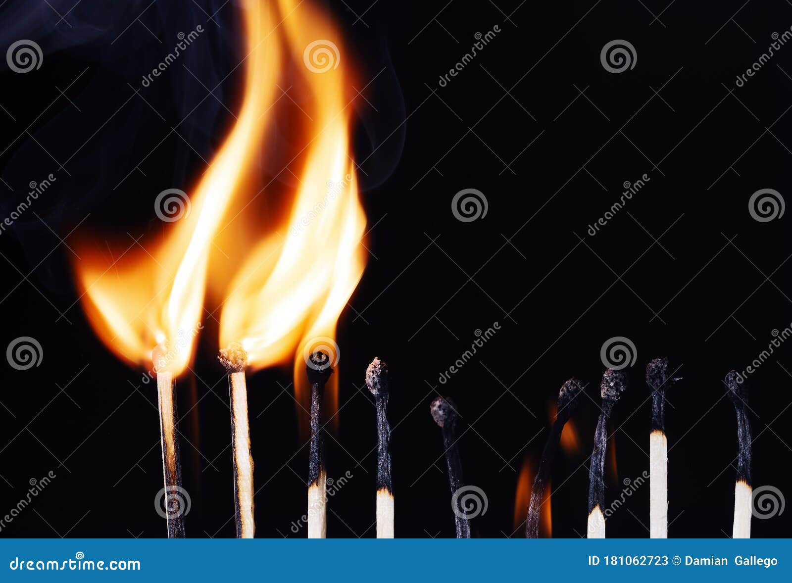 Group of Matches Lit in Row Burning in Chain Reaction with Black ...
