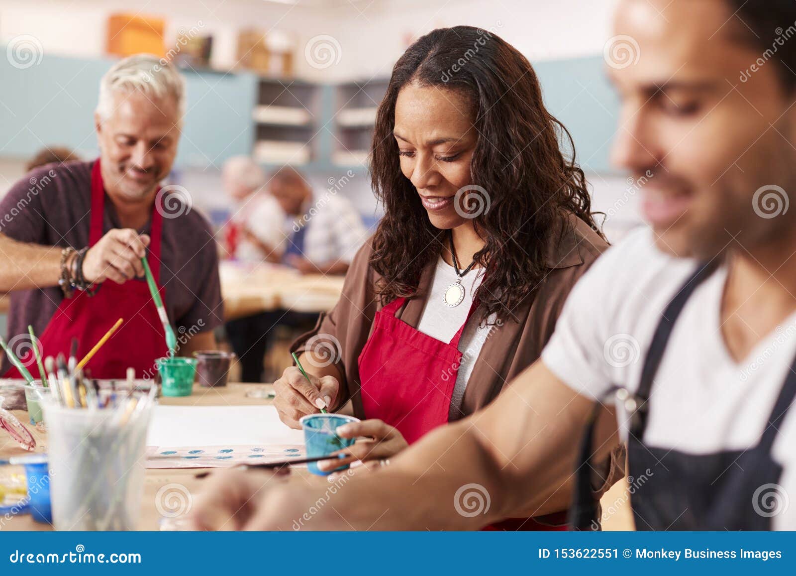 Group of Mature Adults Attending Art Class in Community Centre Stock ...