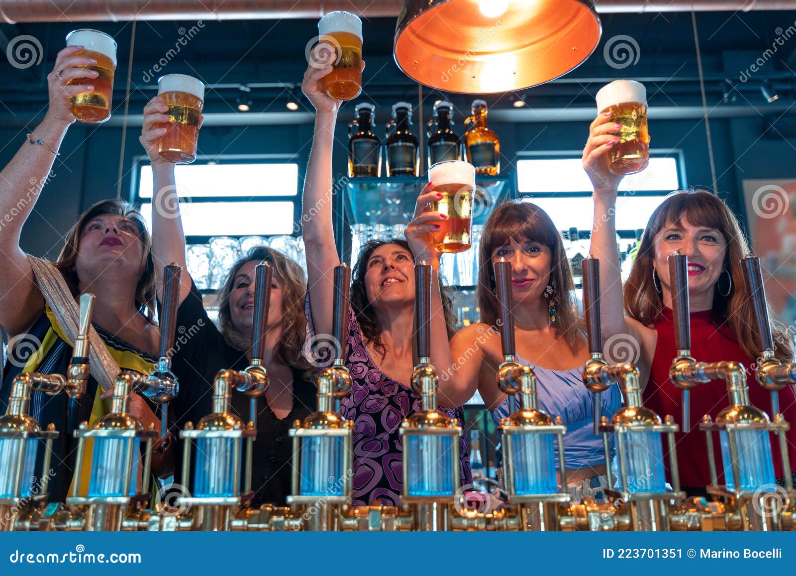 Group of Mature Women is Drinking Beer in Front of a Beer Tap Stock ...