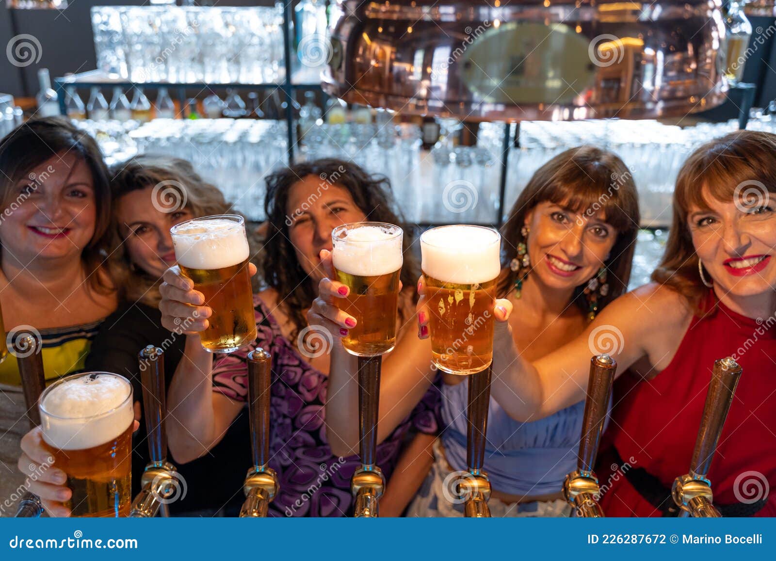 Group of Mature Women is Drinking Beer in Front of a Beer Tap Stock ...