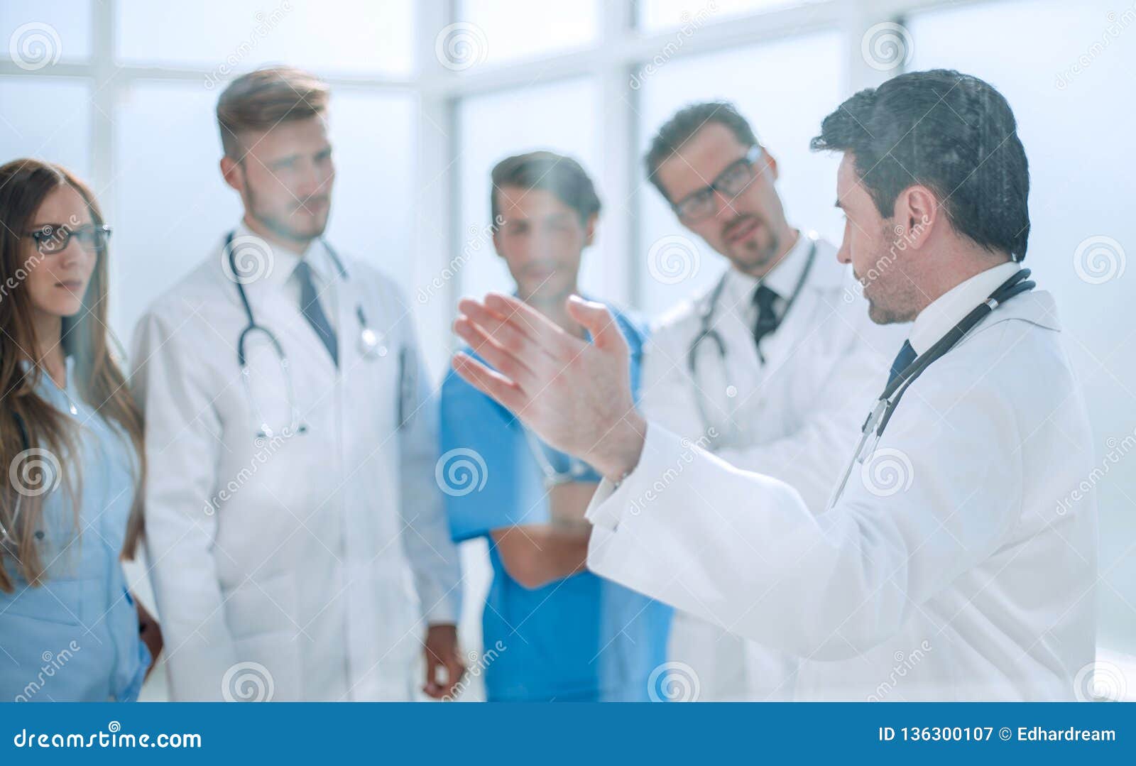 Group of Medical Staff is Discussing in the Corridor of the Clinic ...