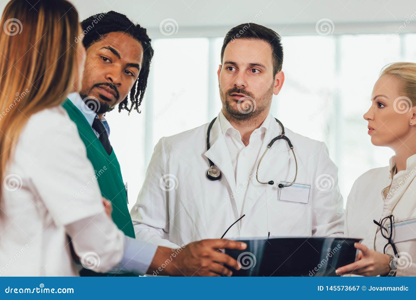Group of Medics Discuss X-ray Scan Stock Image - Image of occupation ...