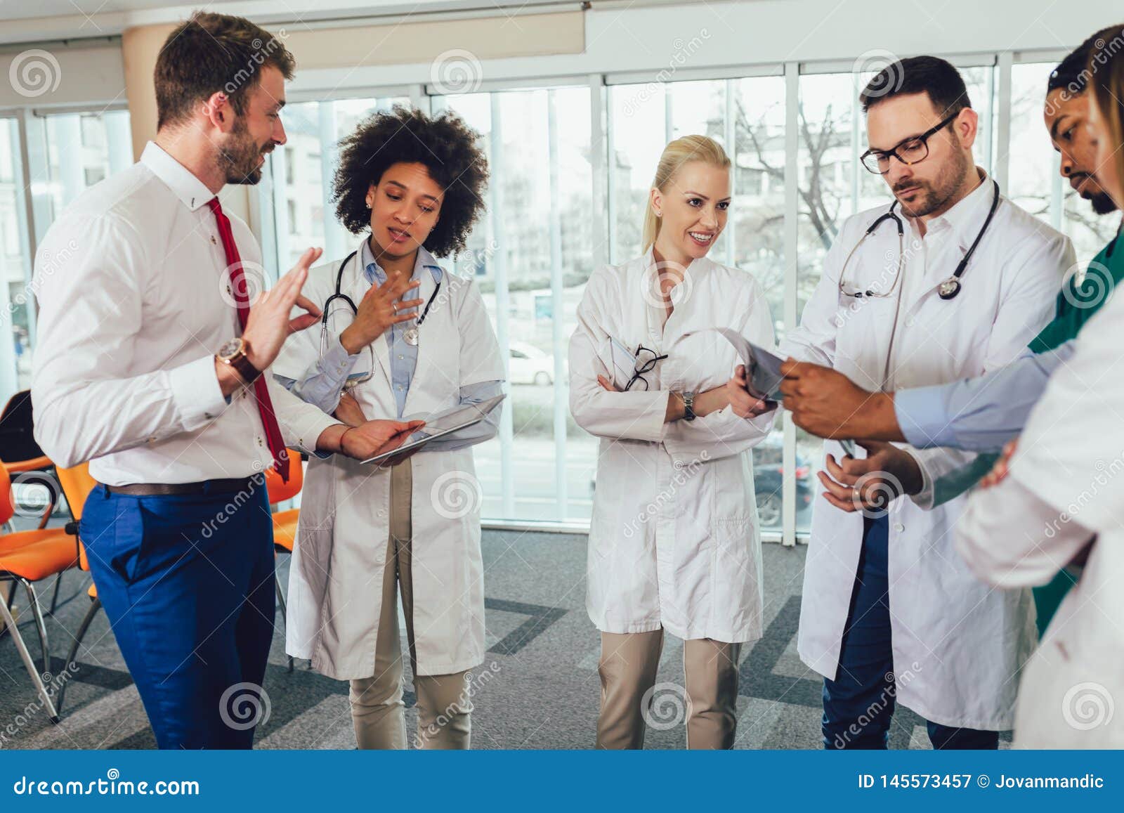 Group of Medics Discuss X-ray Scan Stock Image - Image of adviser ...
