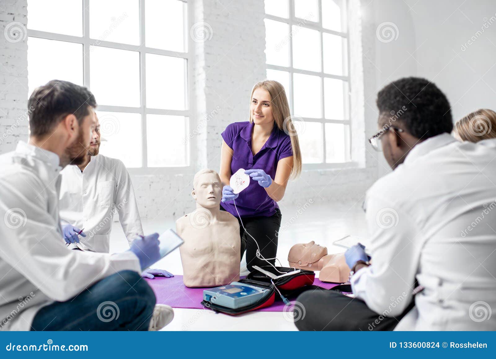 Group of Medics during the First Aid Training Indoors Stock Photo ...