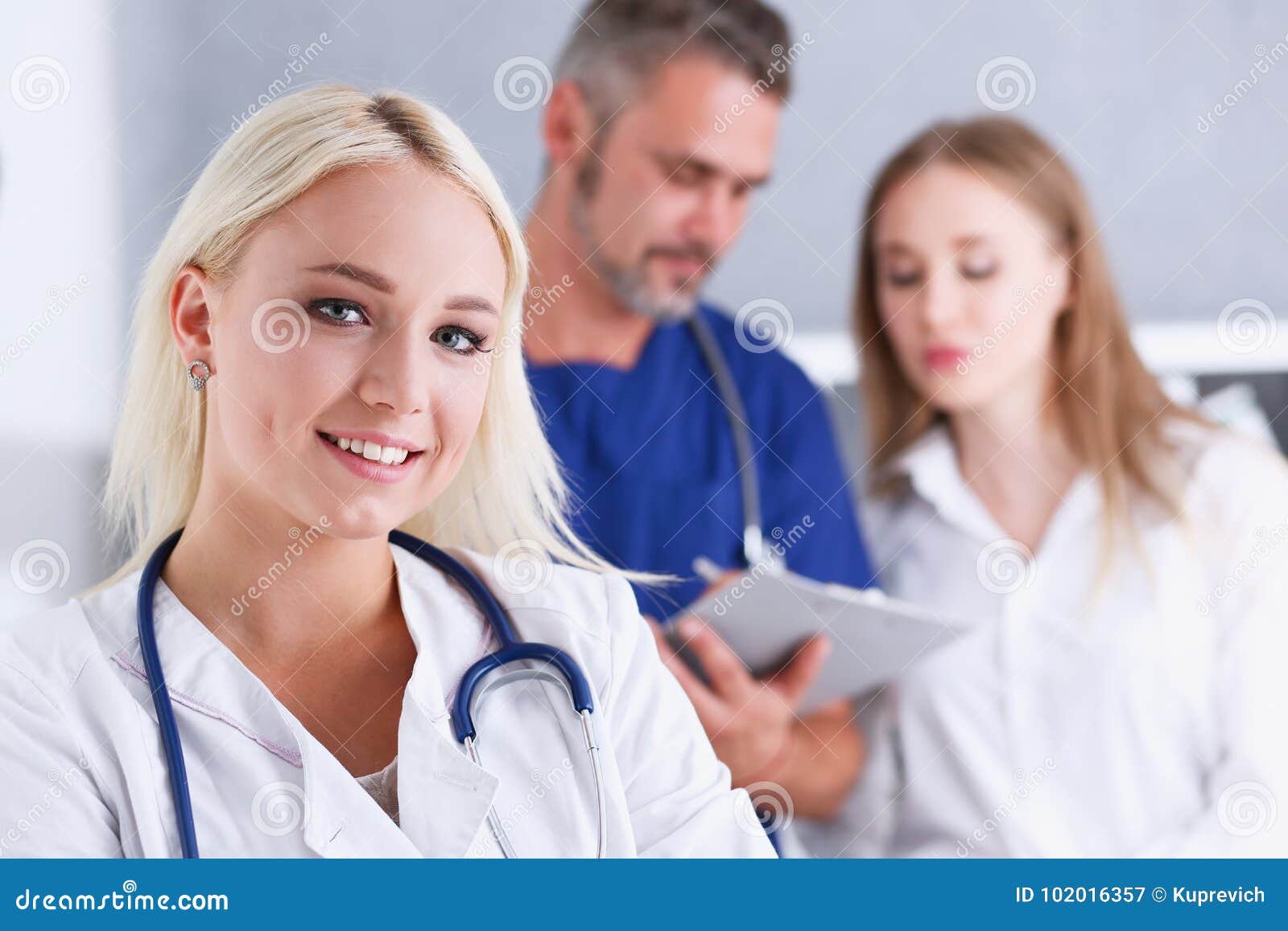 Group of Medics Proudly Posing in Row and Looking in Camera Stock Image ...