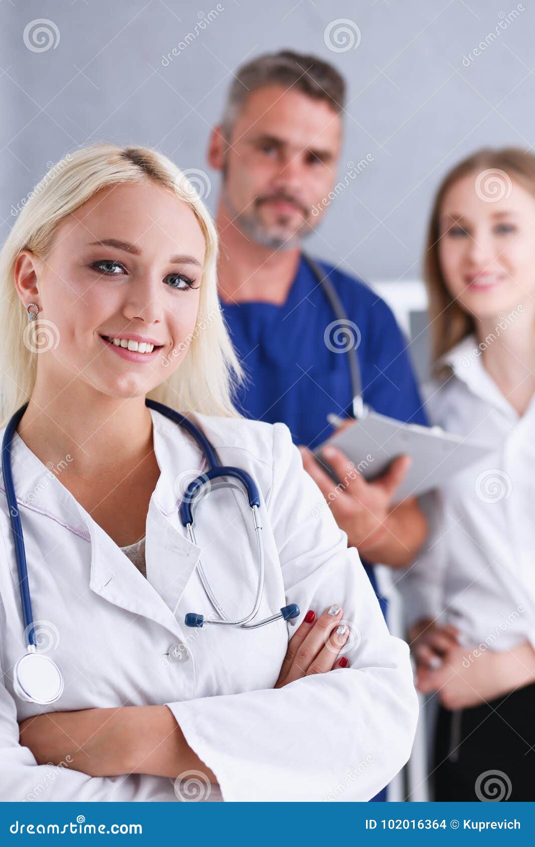 Group of Medics Proudly Posing in Row and Looking in Camera Stock Photo ...