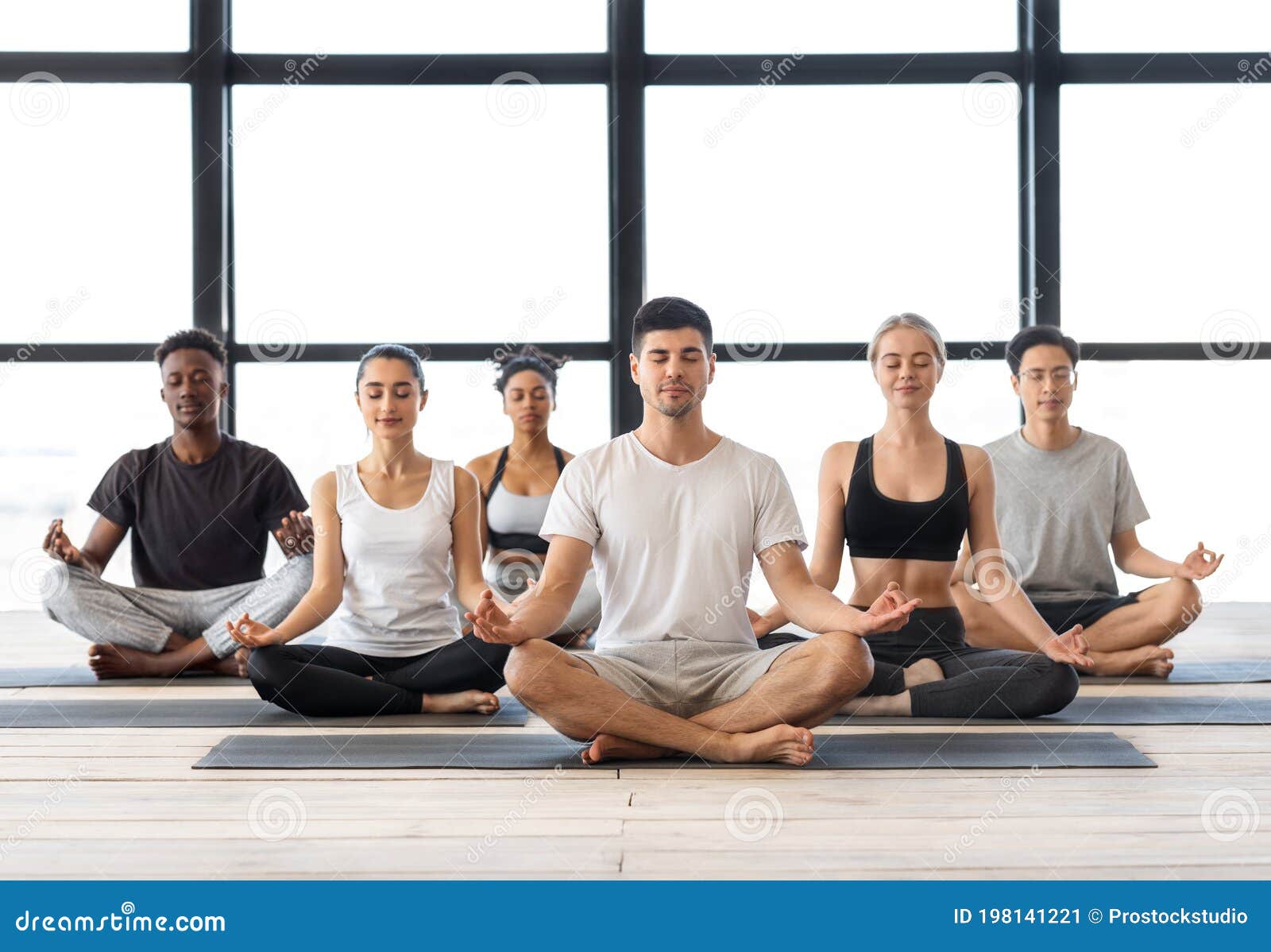 Group Meditation. Young Multiethnic Men and Woman Meditating Together ... Group Meditation. Young Multiethnic Men and Woman Meditating Together ...