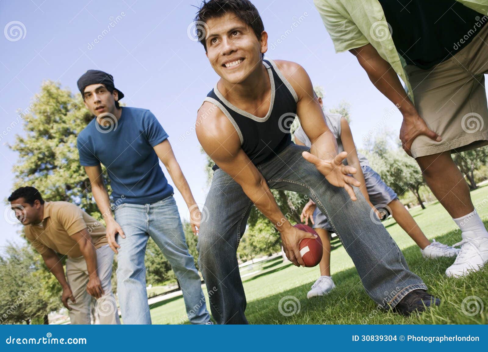 Group of Men Playing Football in Park Low Angle View. Stock Photo ...