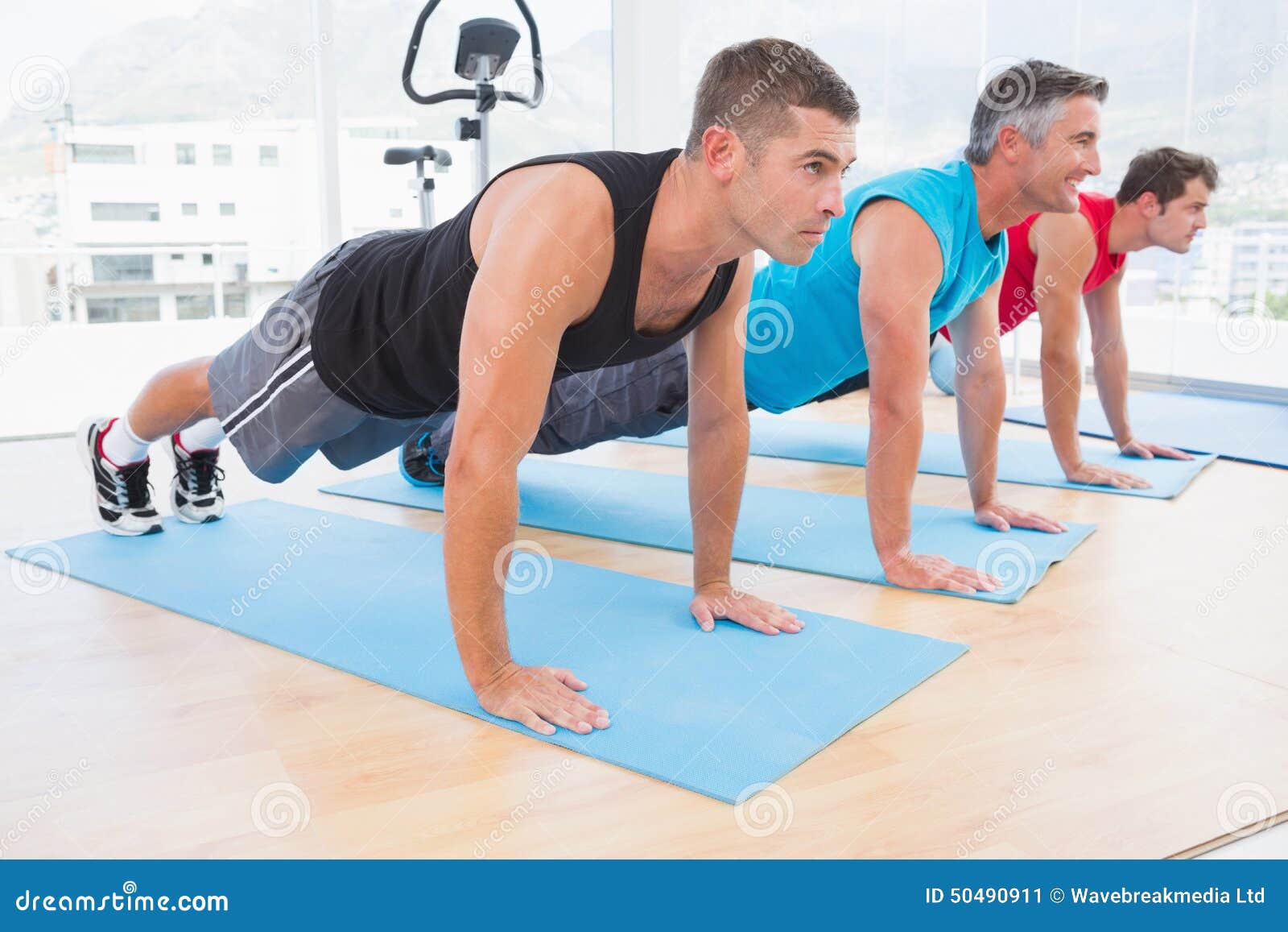 Group of Men Working on Exercise Mat Stock Image - Image of fitness ...