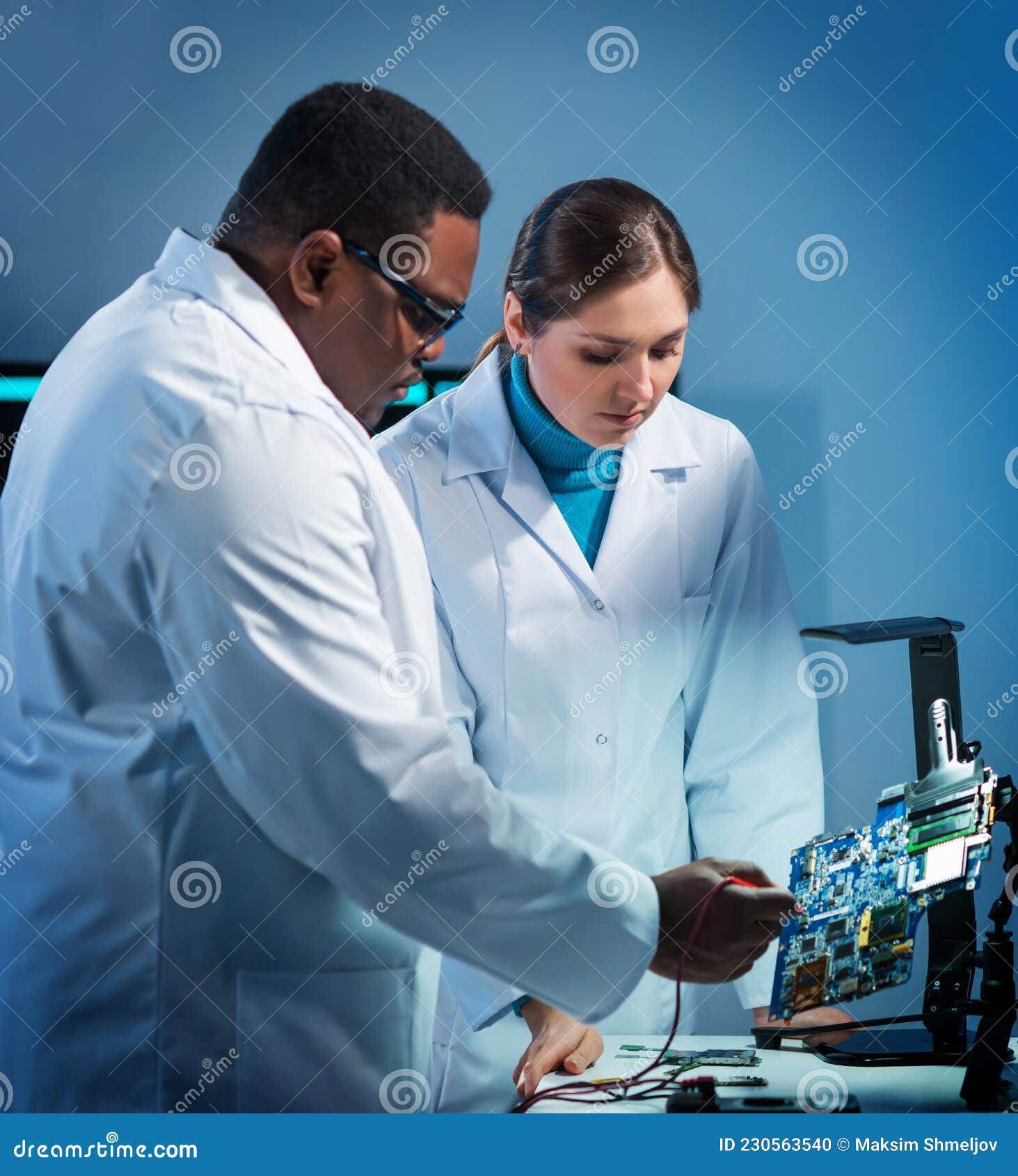 Group of Microelectronic Engineers Discussing in a Modern ...