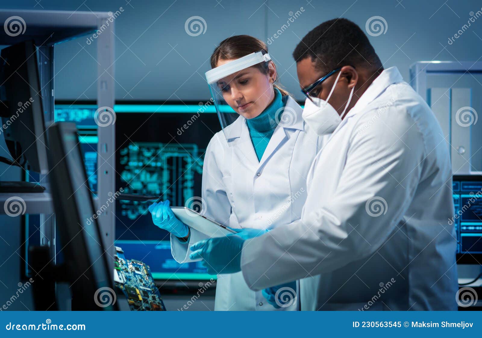 Group of Microelectronic Engineers Discussing in a Modern ...