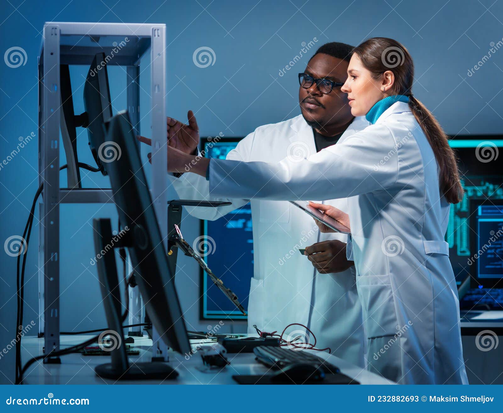 Group of Microelectronic Engineers Discussing in a Modern ...