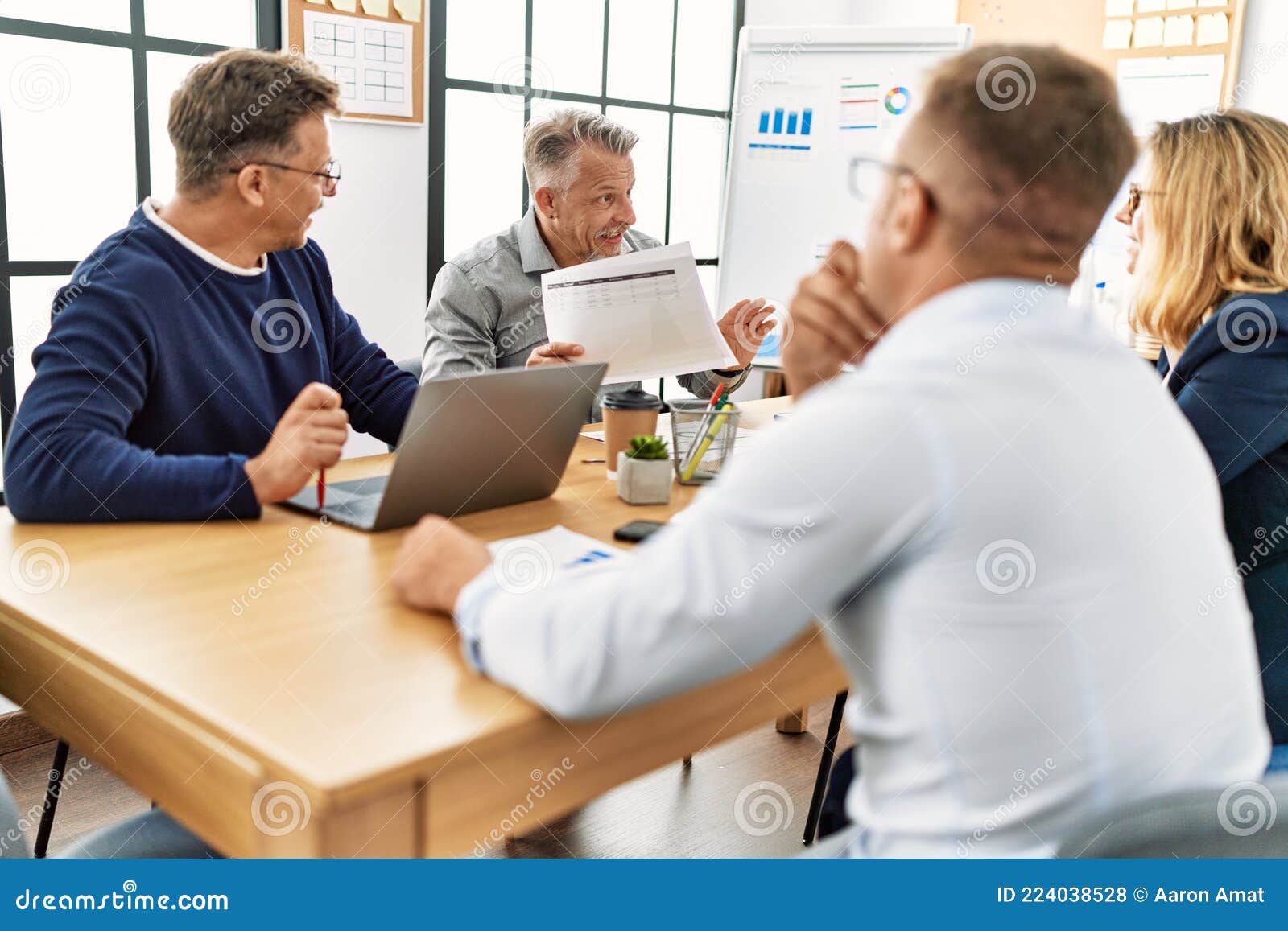 Group of Middle Age Business Workers Working at the Office Stock Photo ...