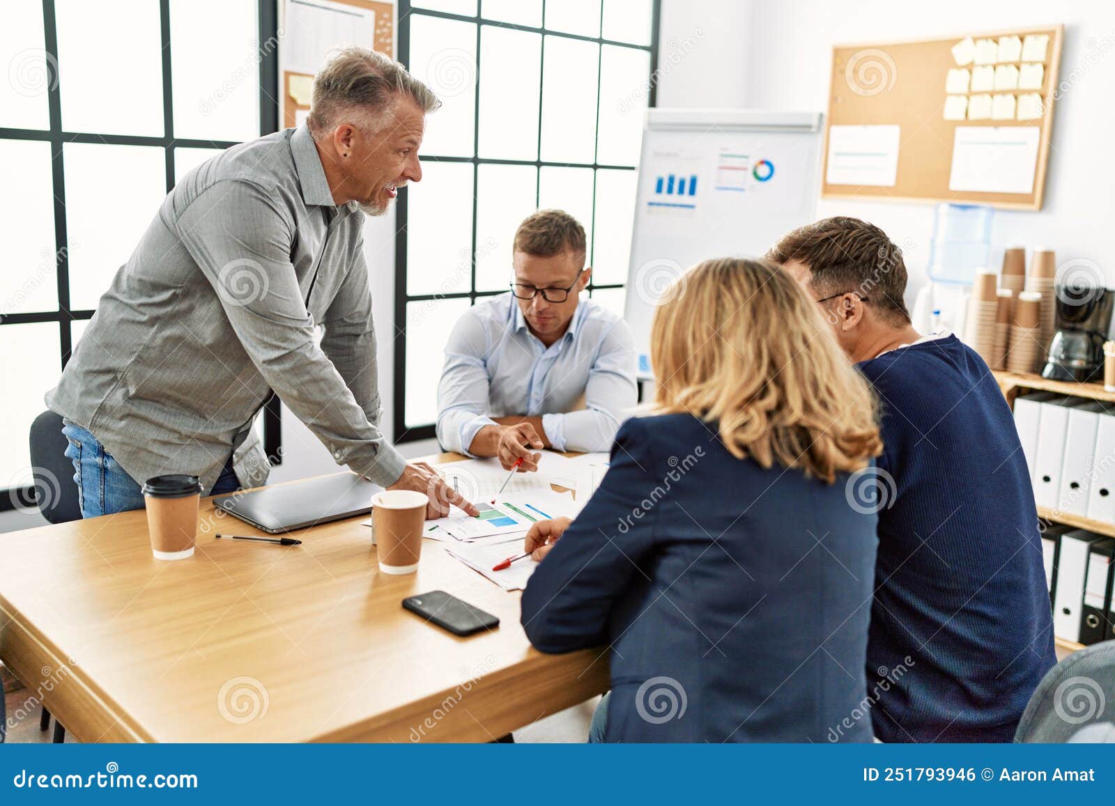 Group of Middle Age Business Workers Working at the Office Stock Photo ...