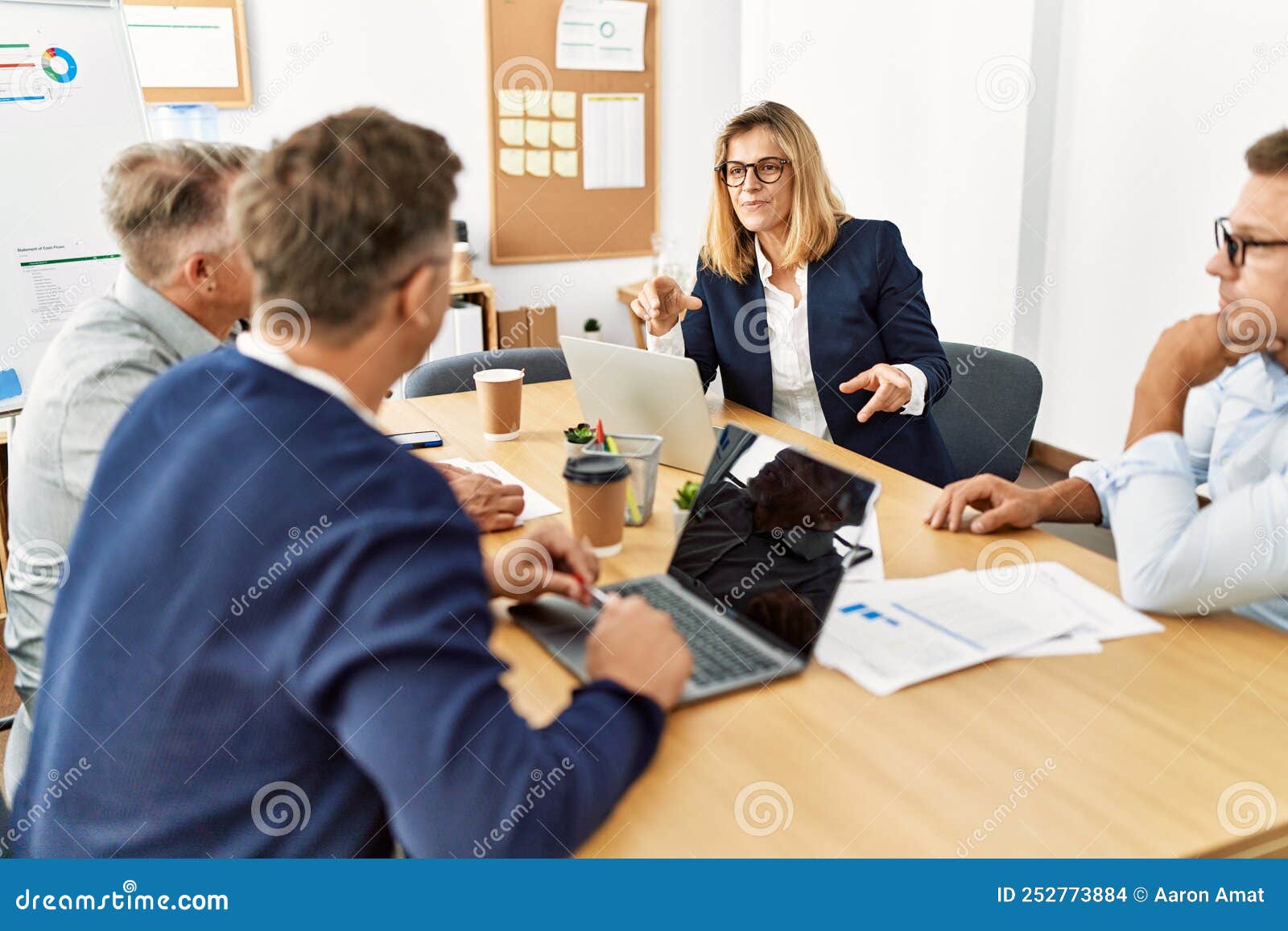 Group of Middle Age Business Workers Working at the Office Stock Photo ...