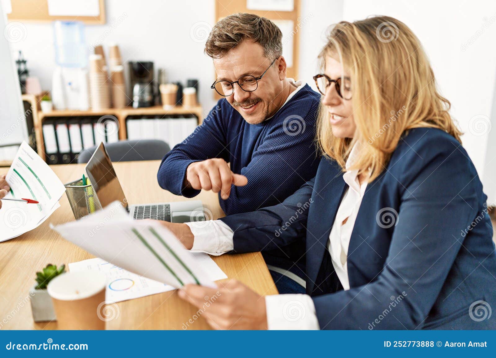 Group of Middle Age Business Workers Working at the Office Stock Photo ...