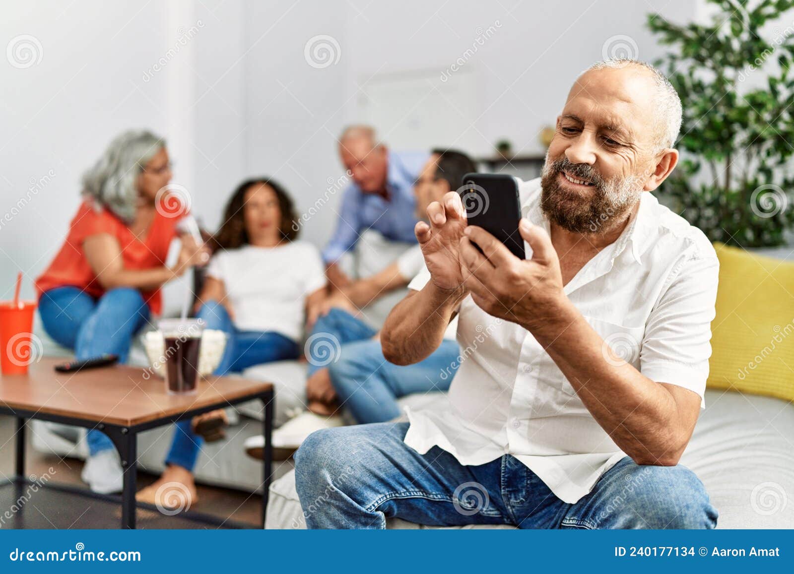 Group of Middle Age Friends Sitting on the Sofa Speaking Stock Photo ...
