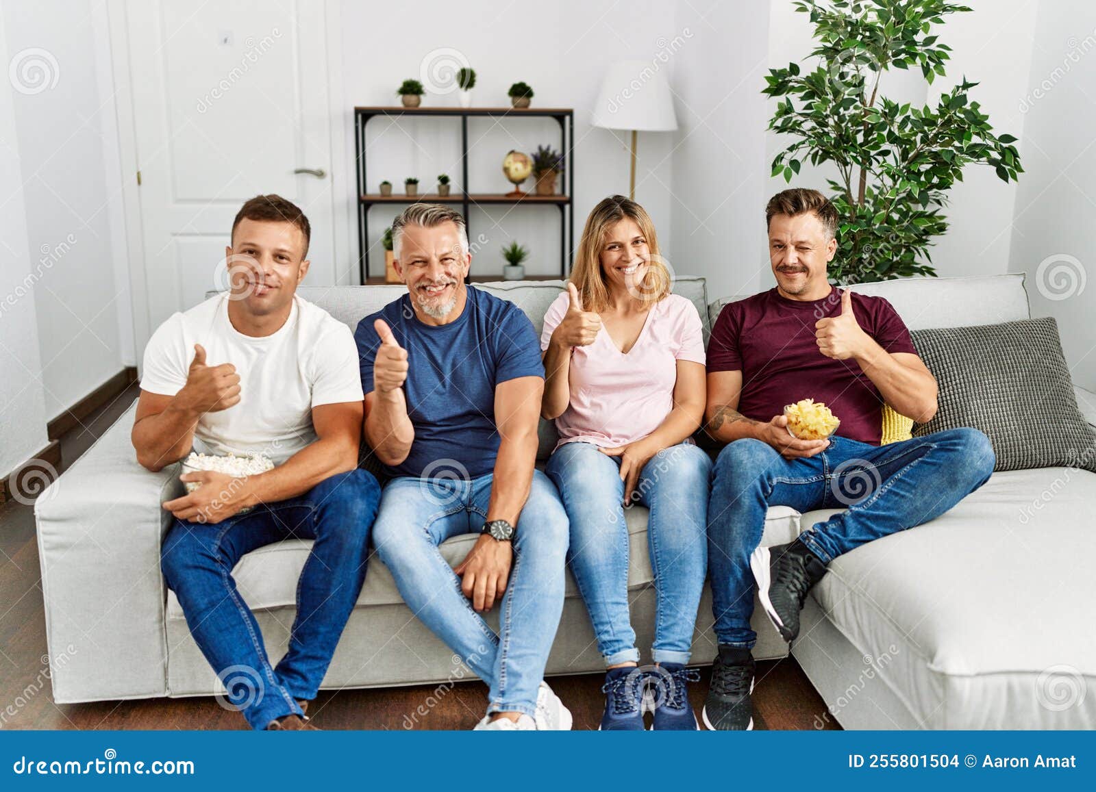Group of Middle Age People Sitting on the Sofa at Home Doing Happy ...