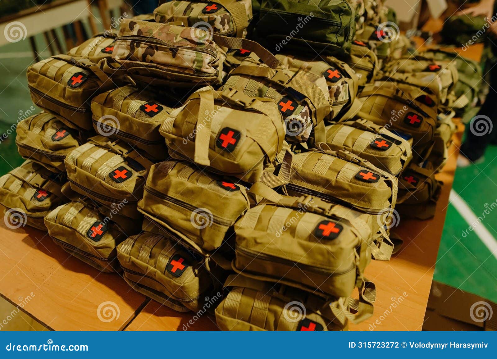 A Group of Military First Aid Kits on a Table. Tactical First Aid Kits ...