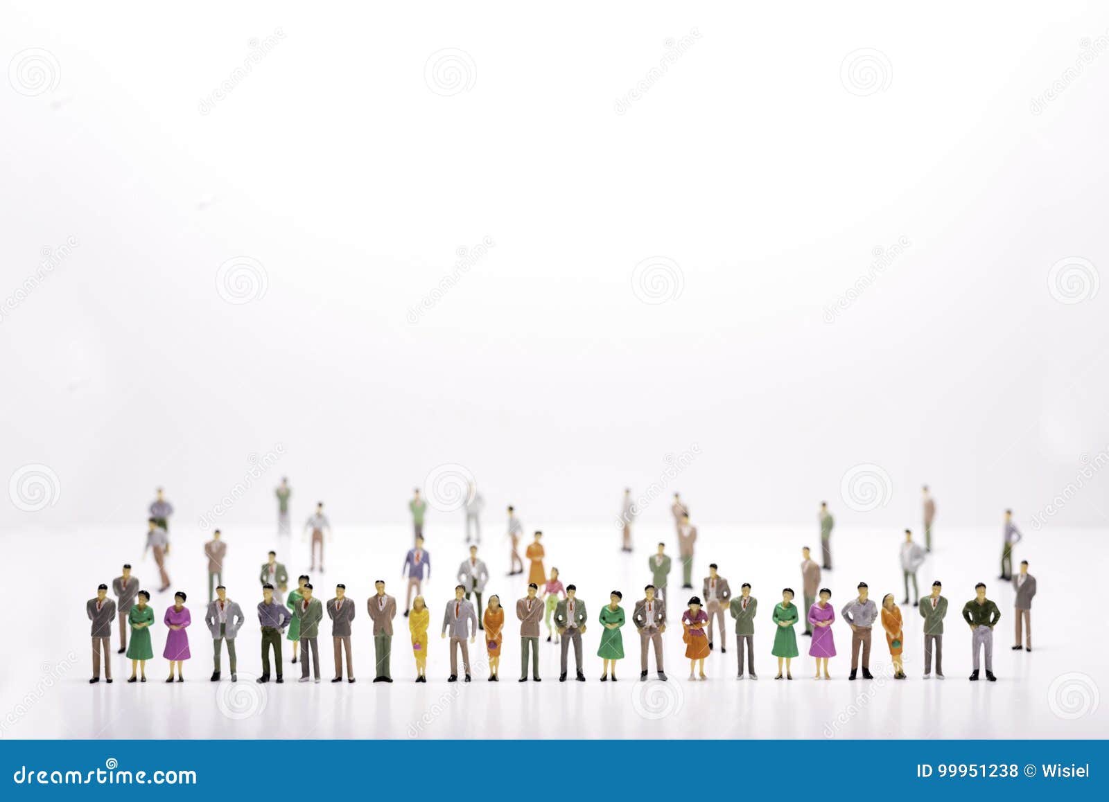 Group of Miniature People Over White Background Standing in Line Stock ...