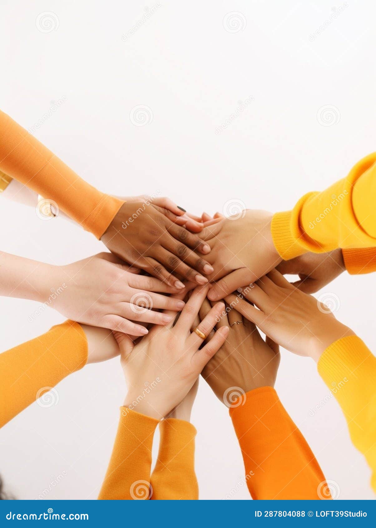 Group_of_mixed_friends_with_stack_of_hands_1690507646313_3 Stock ...